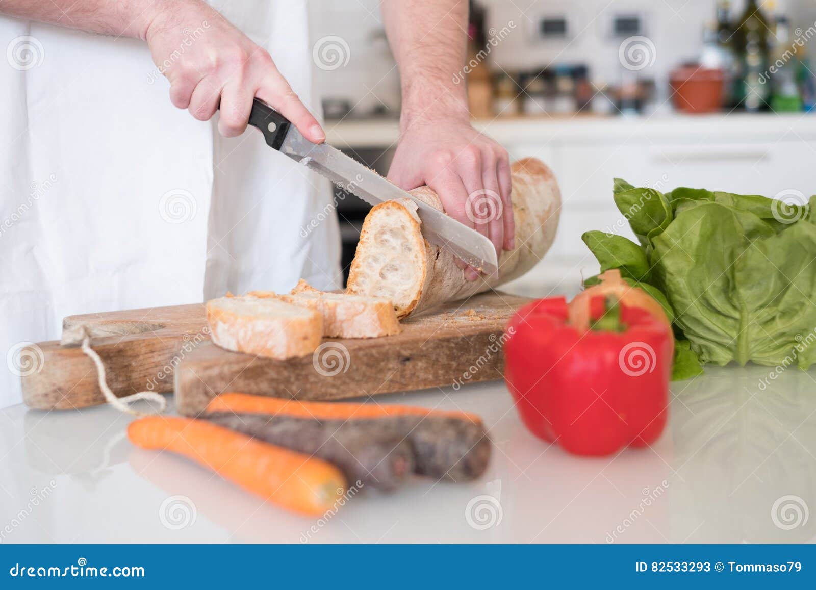 Man Hands Cutting Bread Slices in the Kitchen Stock Image - Image of ...
