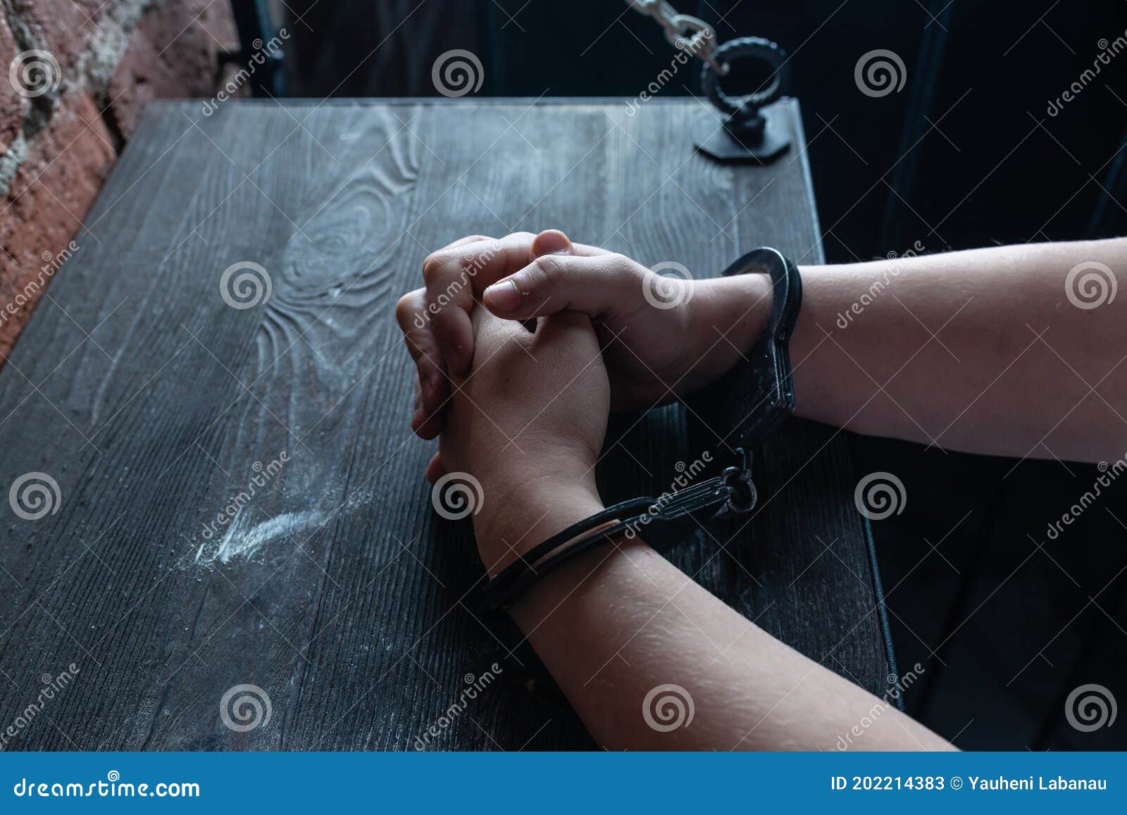A Man with Hands in Handcuffs at Table Stock Image - Image of ...