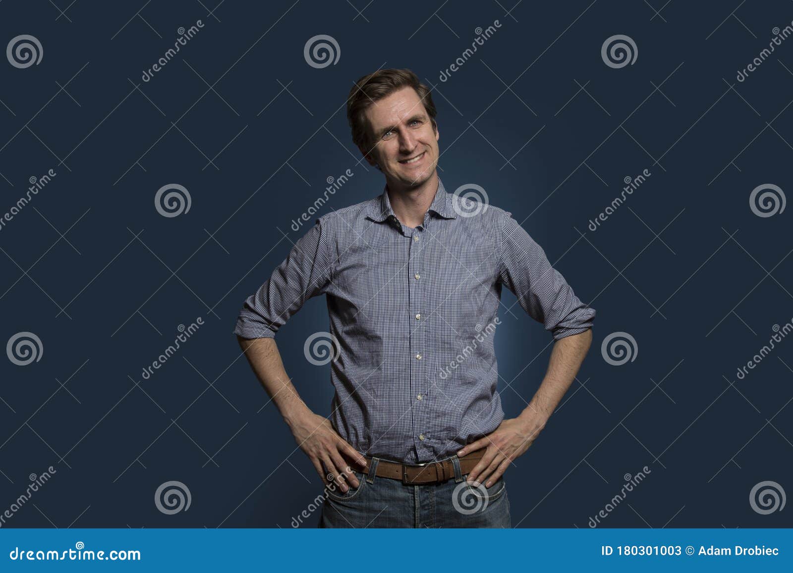 Man with Hands on Hips Smiling with Head Slanted Stock Image - Image of ...