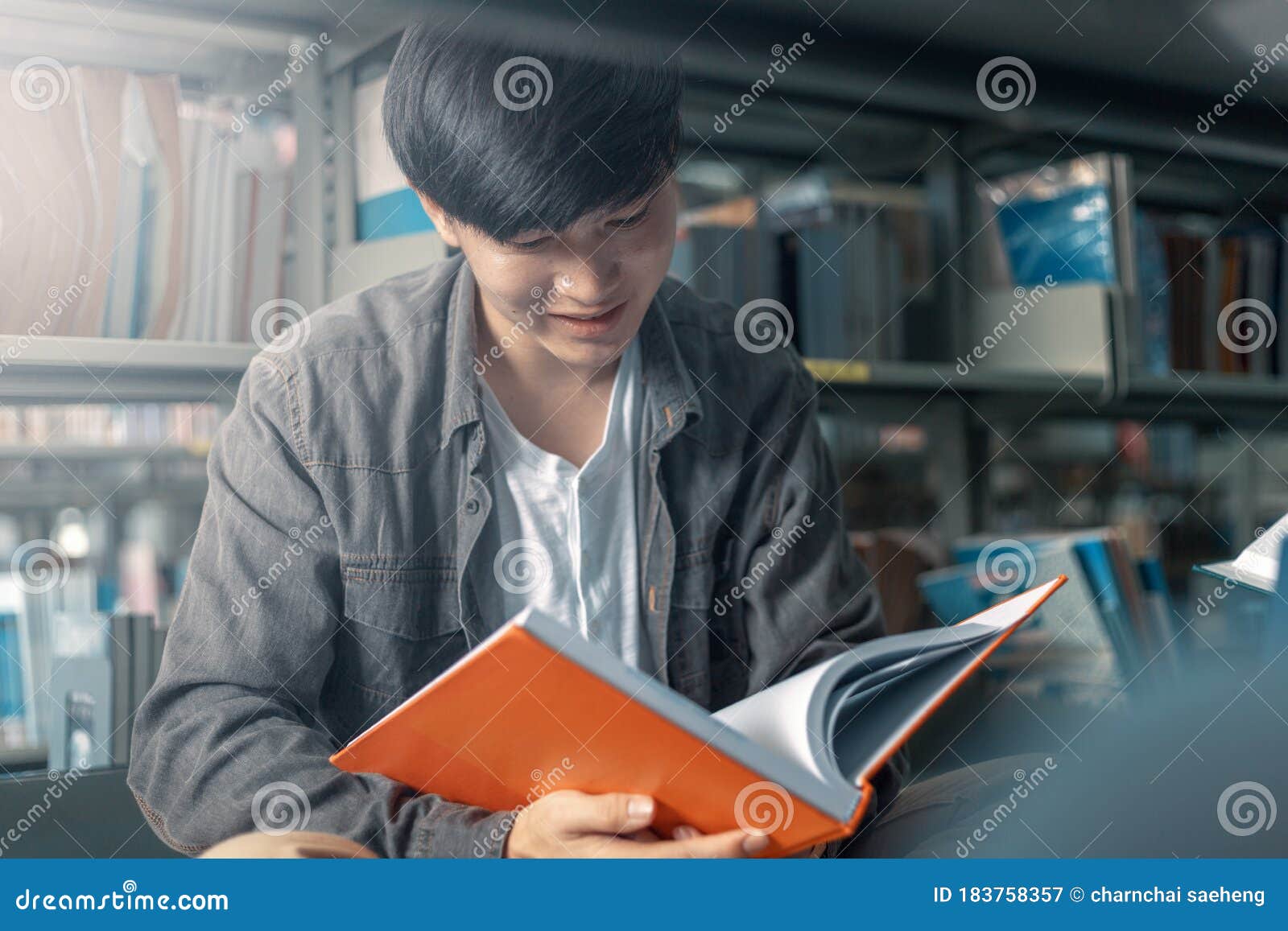 A Man Hands Opening and Reading a Book at Library Stock Image - Image ...