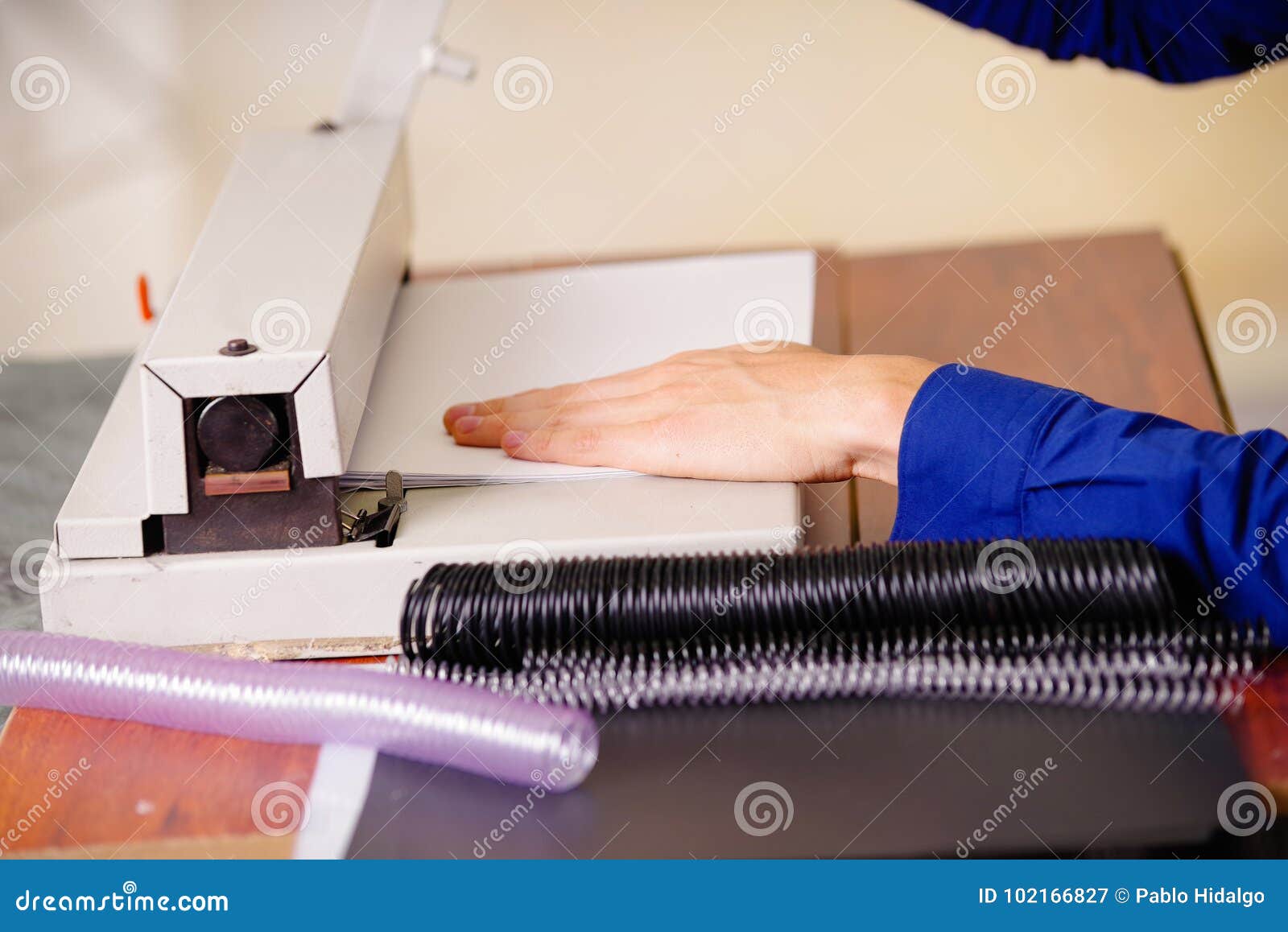 Man Hands Over a Binder Using for Binding Documents with Plastic Ring ...