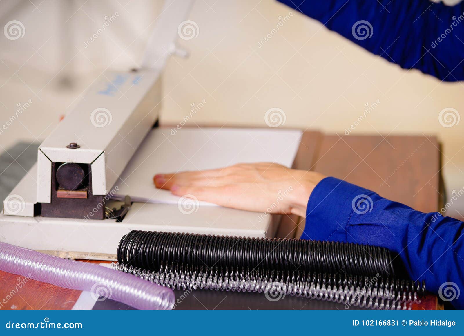 Man Hands Over a Binder Using for Binding Documents with Plastic Ring ...