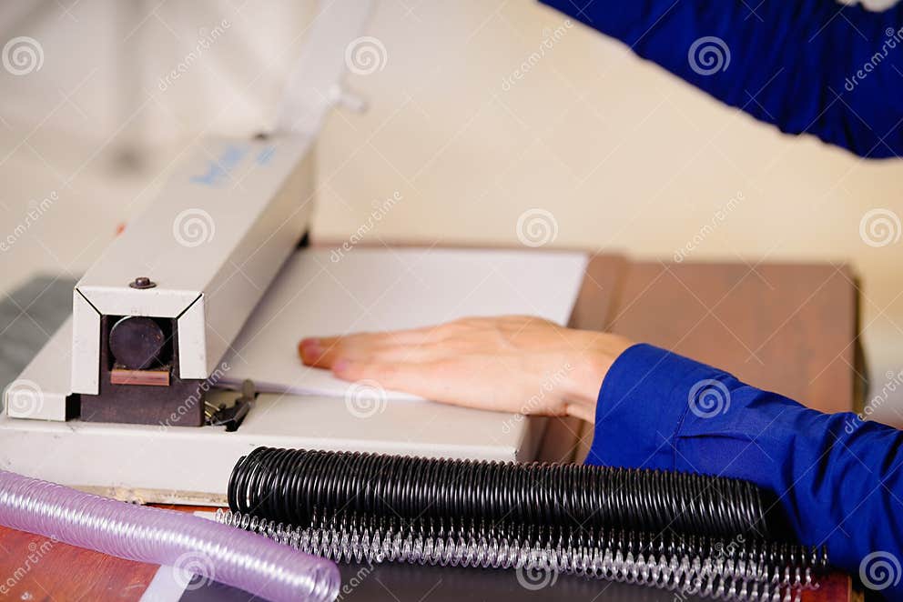 Man Hands Over a Binder Using for Binding Documents with Plastic Ring ...