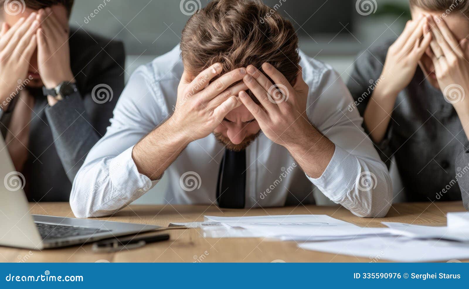 A Man with Hands Over His Face Sitting at a Desk, AI Stock Photo ...