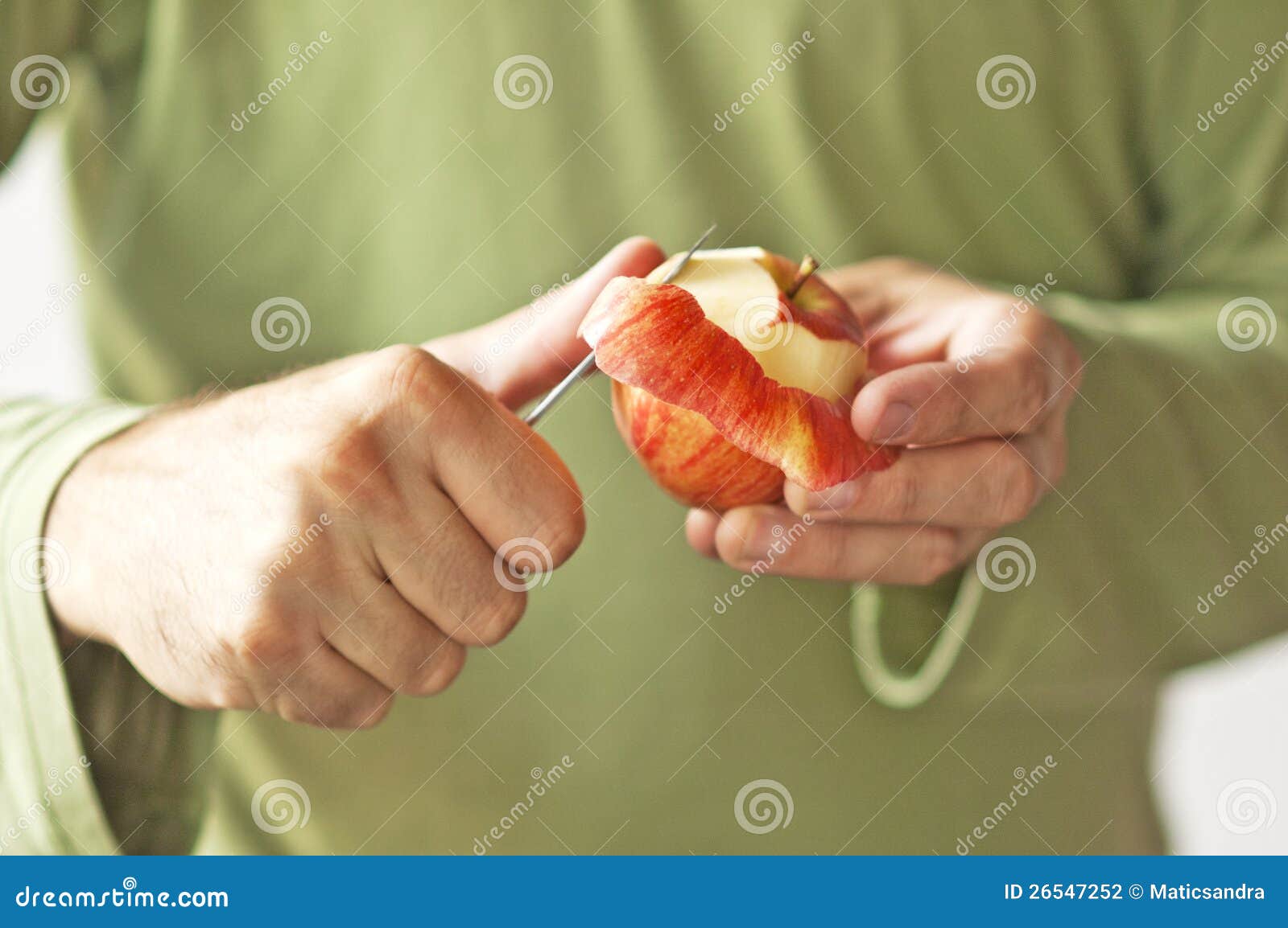 Man hands peeling an apple stock photo. Image of advantage - 26547252