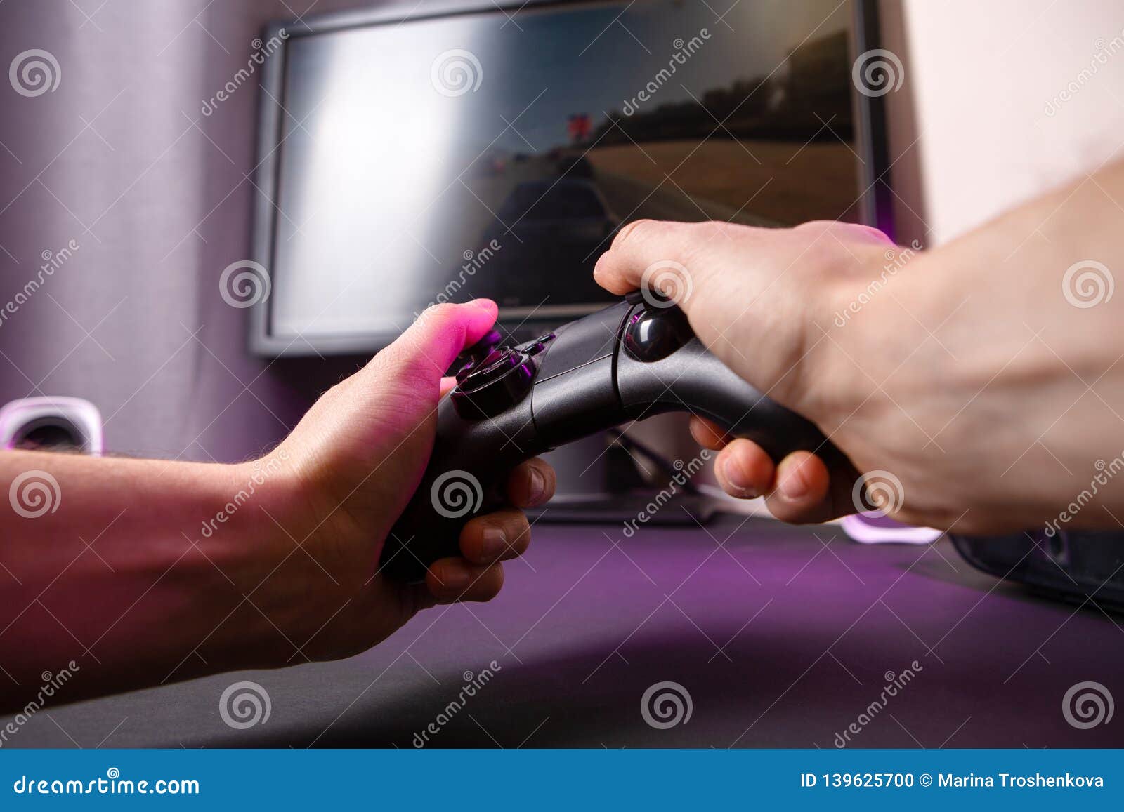 Man Hands Playing a Computer Game with a Game Joystick. Stock Photo ...