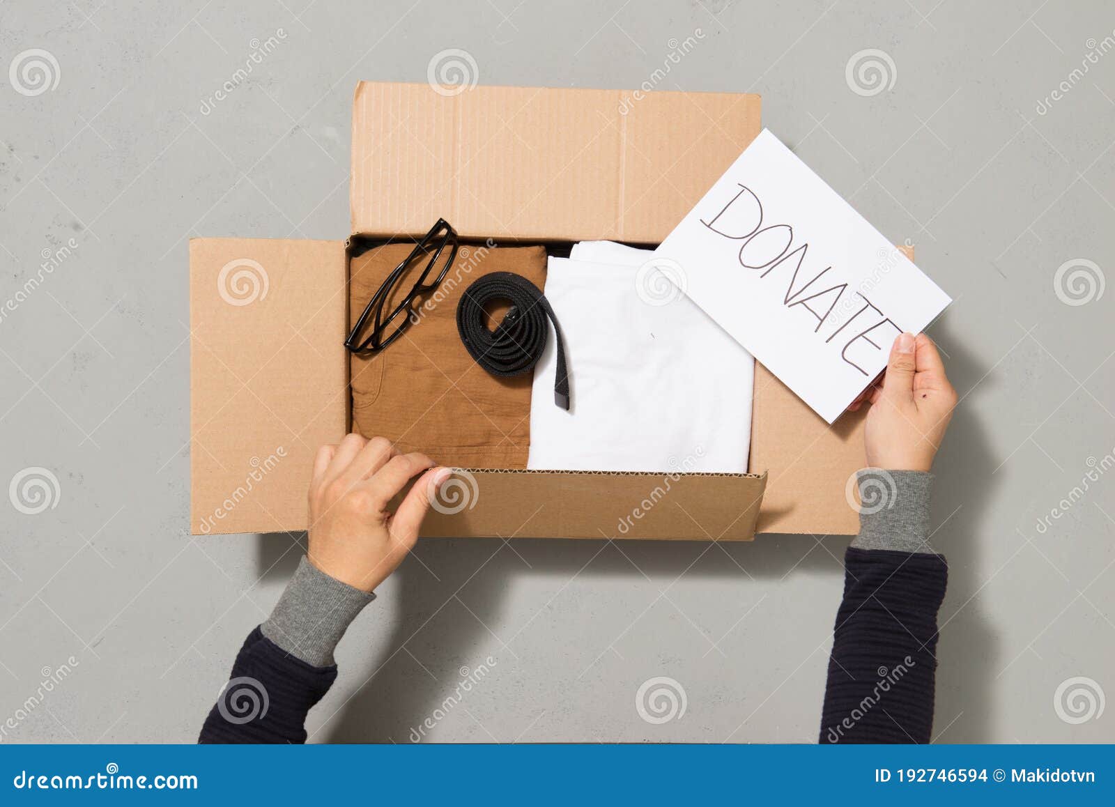 Man Hands Putting Clothes To Donate Box Stock Photo - Image of ...