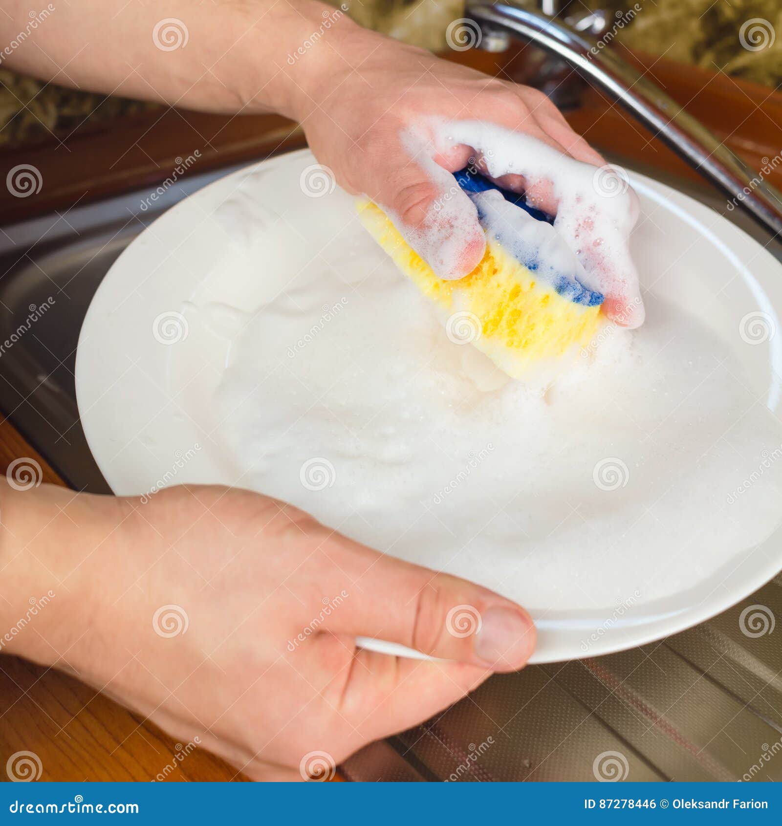 Man Hands, Washing a Sponge with Foam the Dishes at the Kitchen. Stock ...