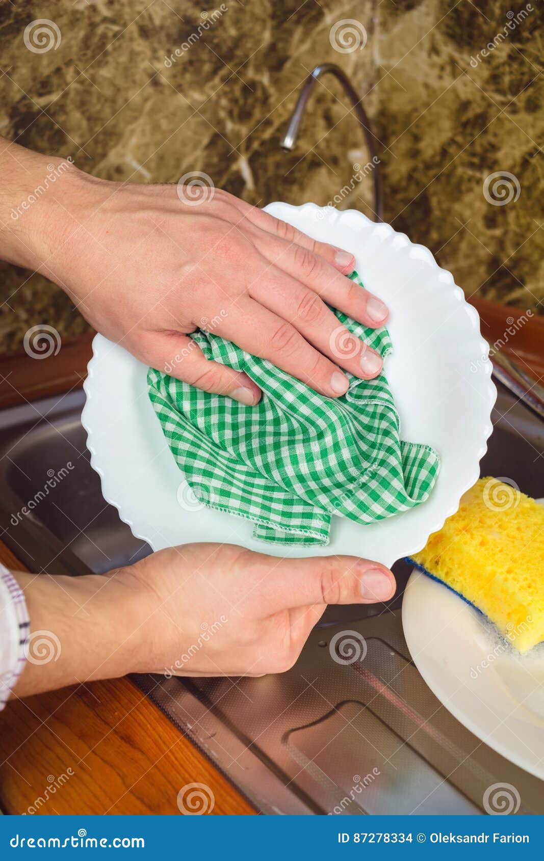 Man Hands Wipe with Towel Clean White Dish at the Kitchen. Stock Photo ...