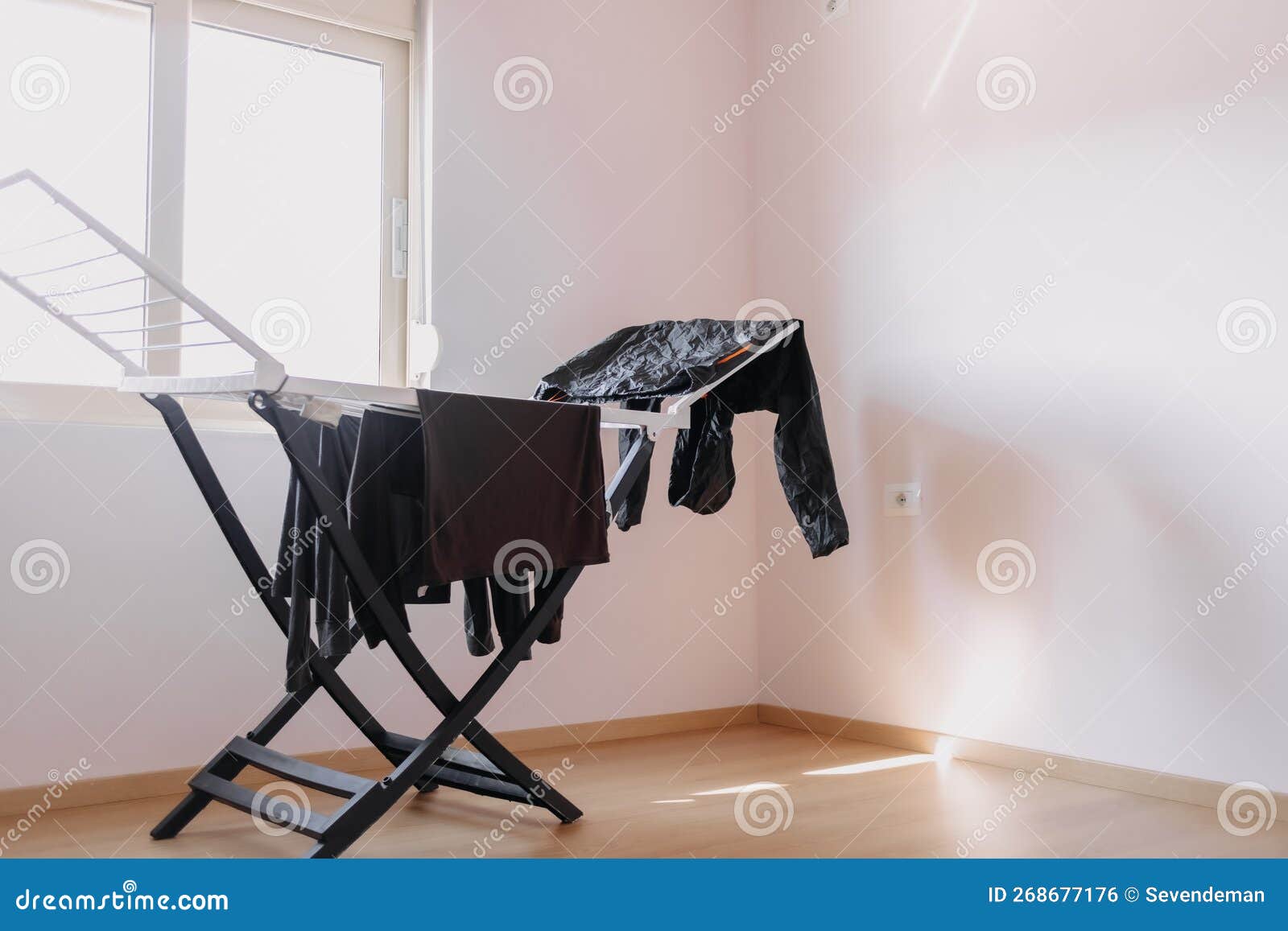 Man Hanging Clothe To Dry by the Sun from the Windows. Home Routine ...