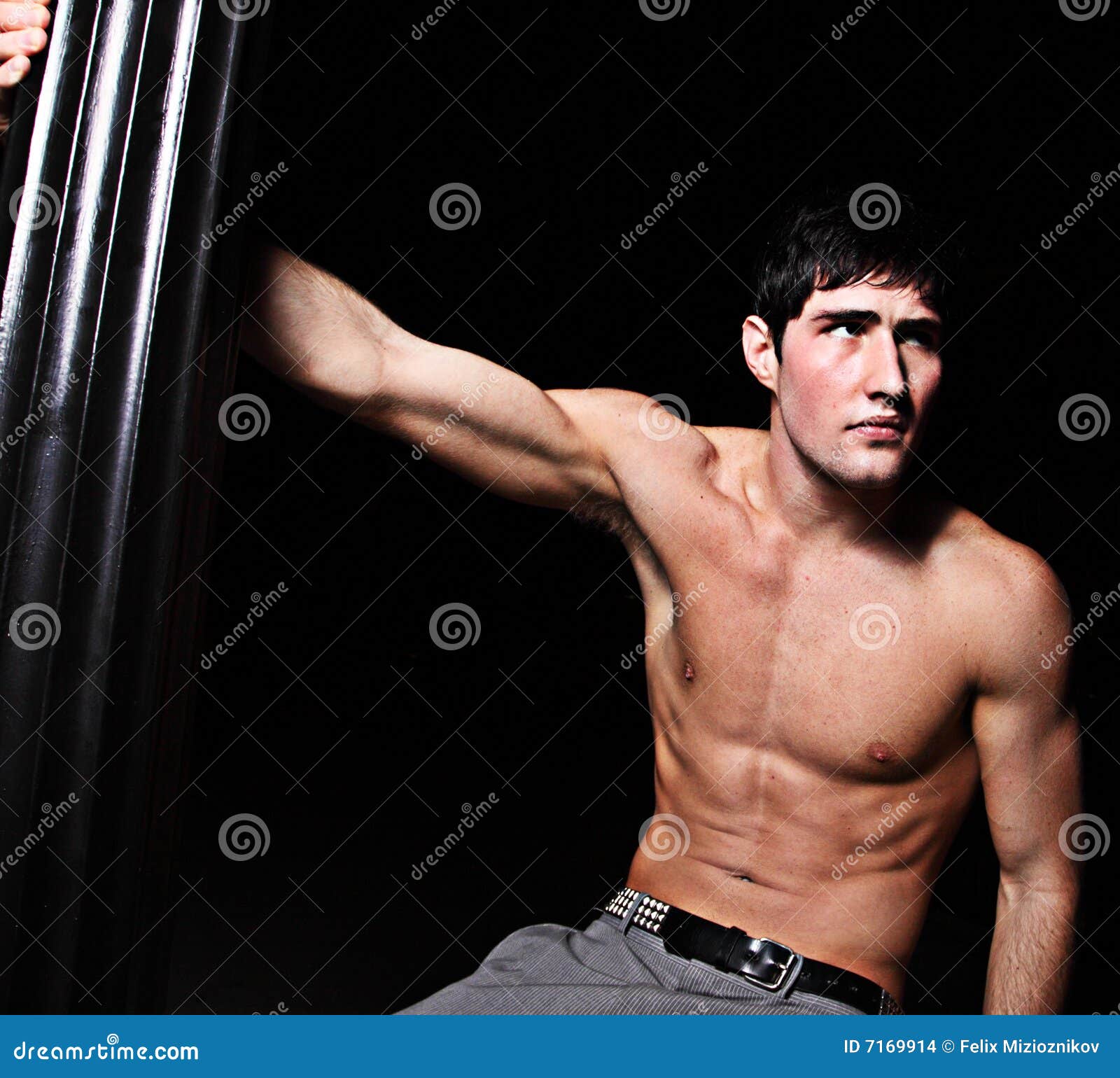 Man hanging from a pole stock photo. Image of attractive - 7169914
