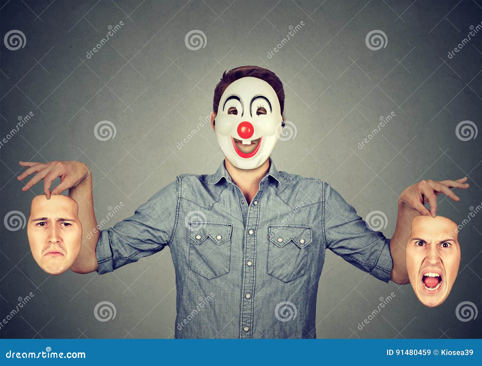 Man in Happy Clown Mask Holding Two Faces Expressing Anger and Sadness ...