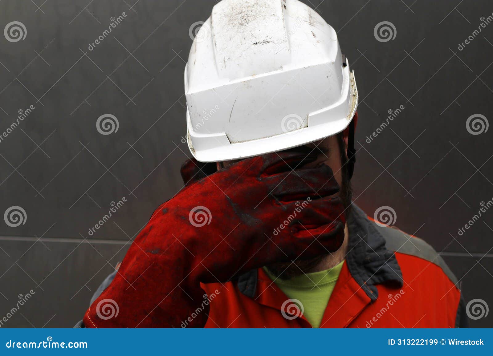 Man in a Hard Hat Shielding His Face with His Hand Stock Image - Image ...