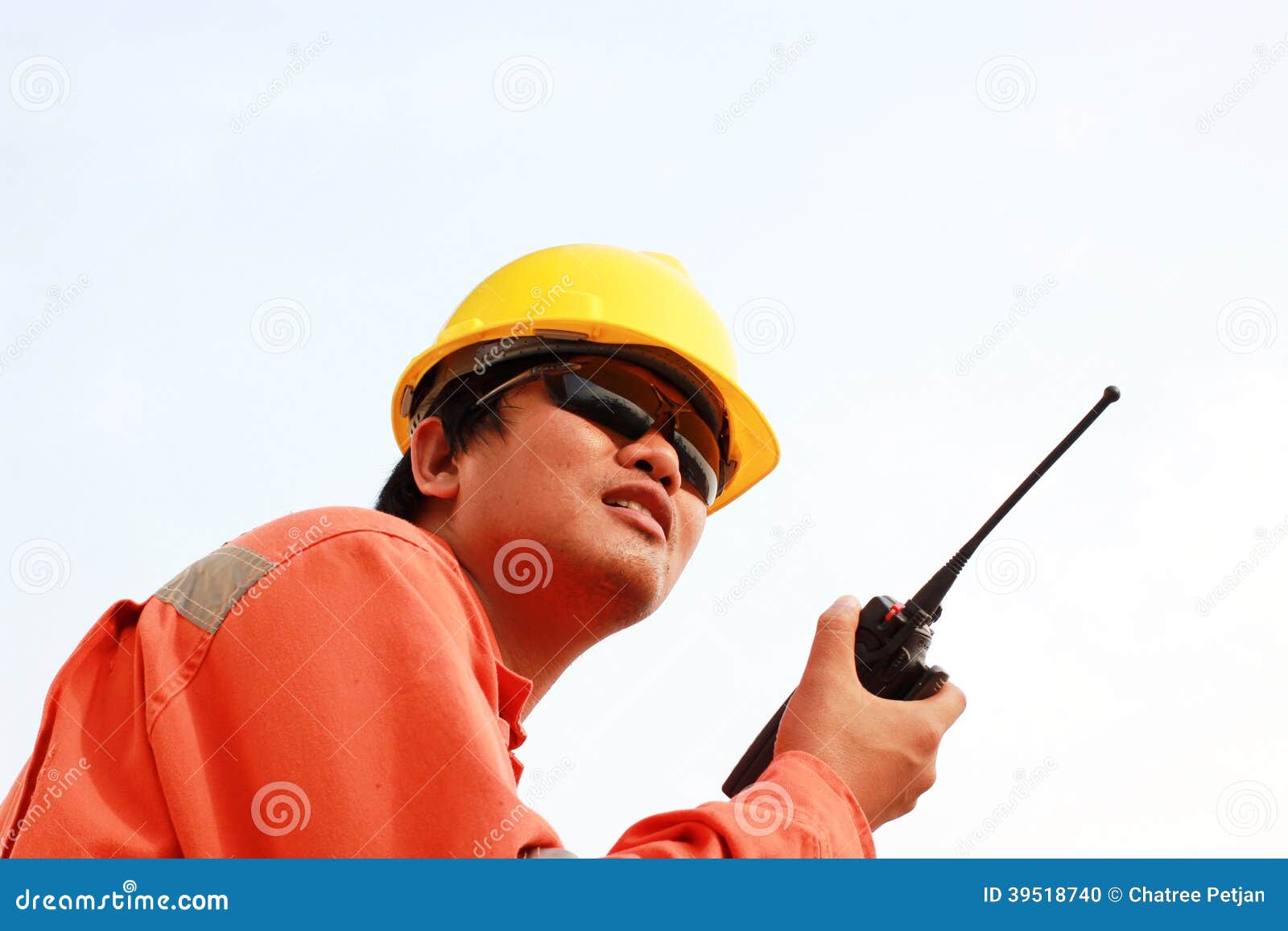 Man in Hard Hat Using Walkie Talkie Stock Photo - Image of industry ...