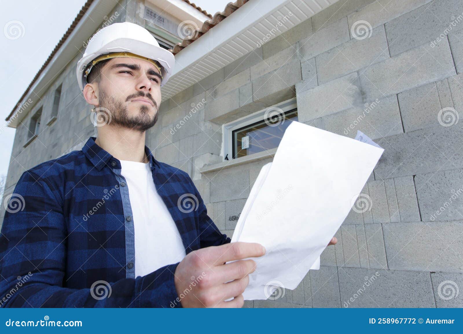 Man in Hardhat Looking at Plans Stock Photo - Image of building ...