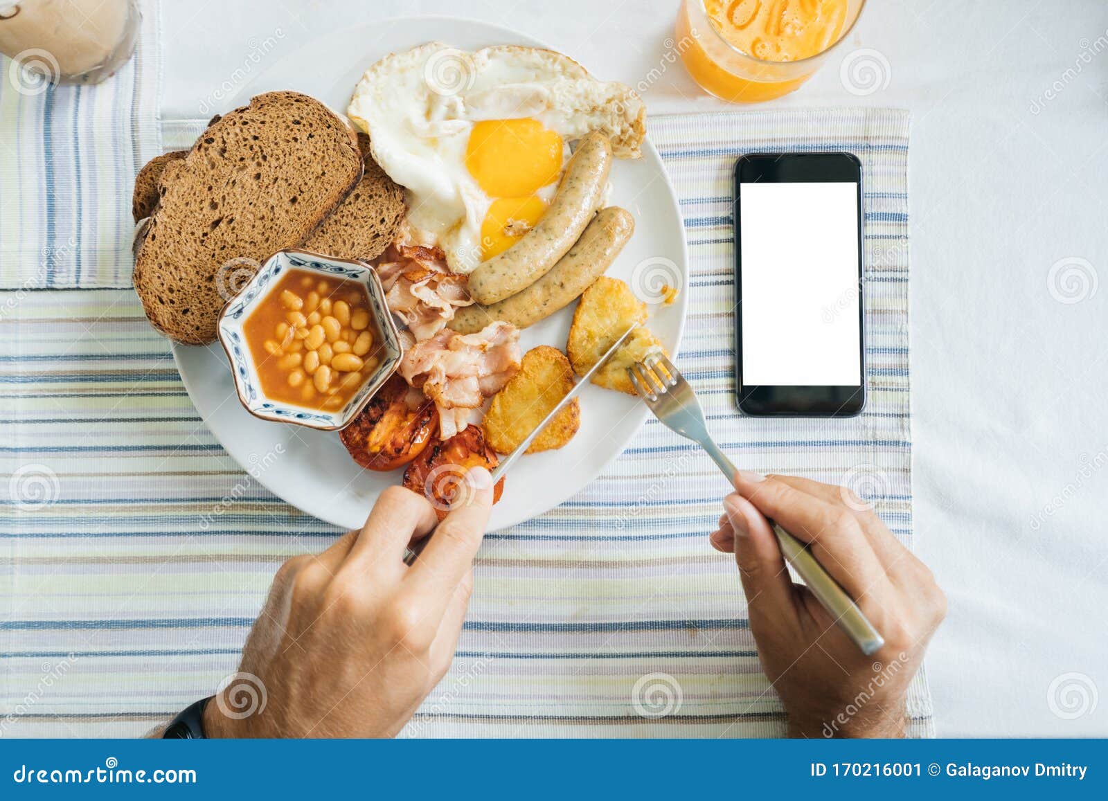 Man Has Breakfast, Hands with a Knife and a Fork, a Dish and a ...