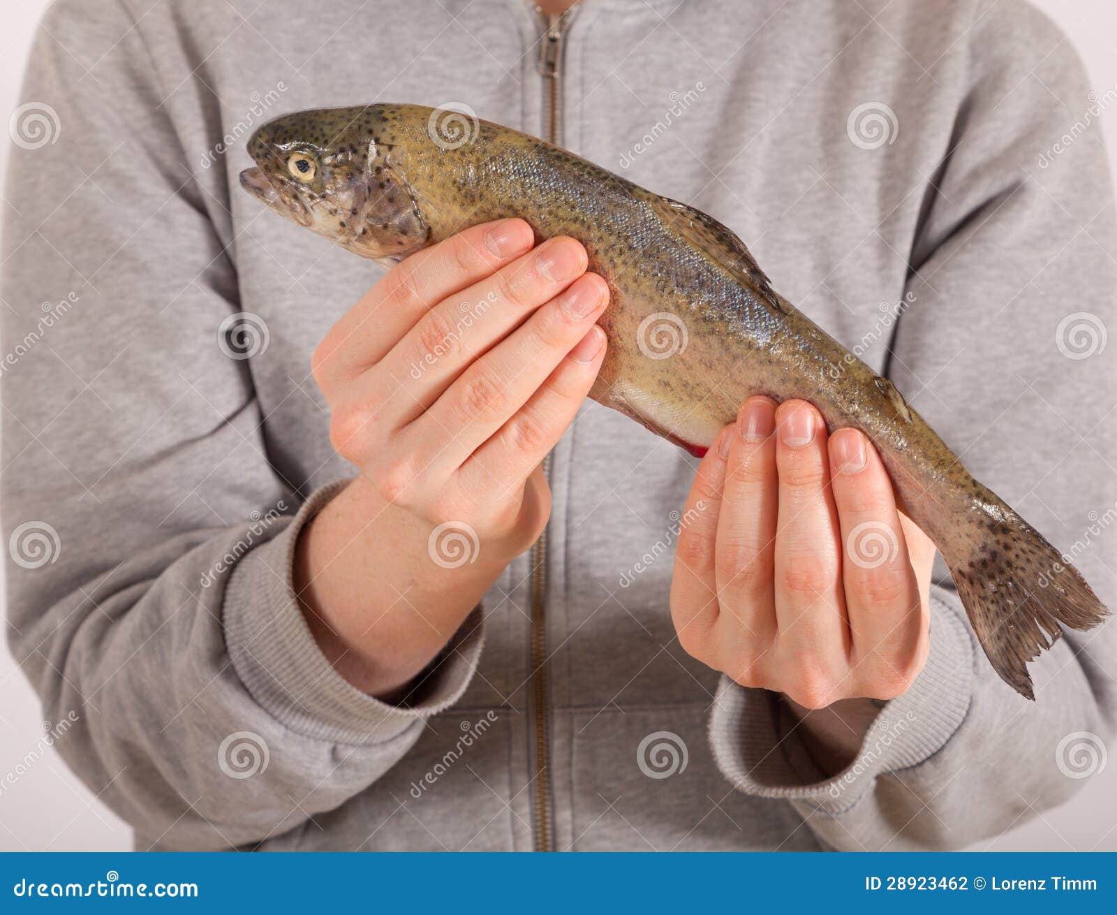 A Man Has a Fish in His Hand Stock Photo - Image of fauna, brown: 28923462