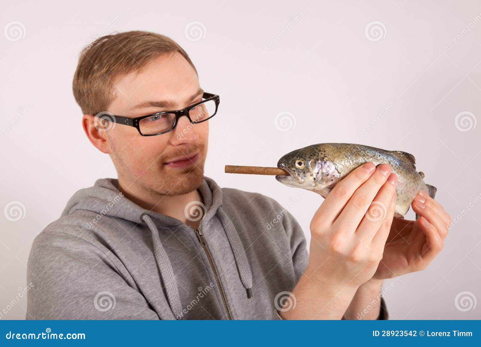 A Man Has a Fish in His Hand Stock Photo - Image of brown, stand: 28923542
