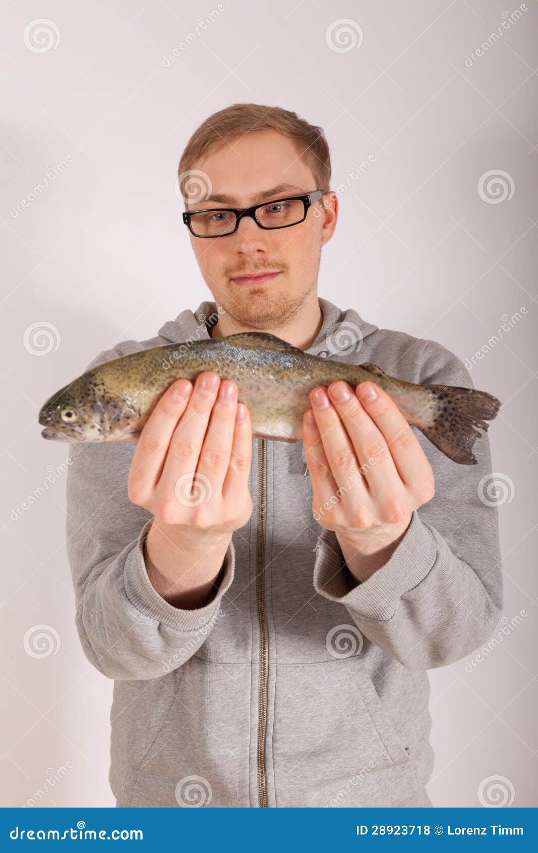 A Man Has a Fish in His Hand Stock Photo - Image of show, trout: 28923718