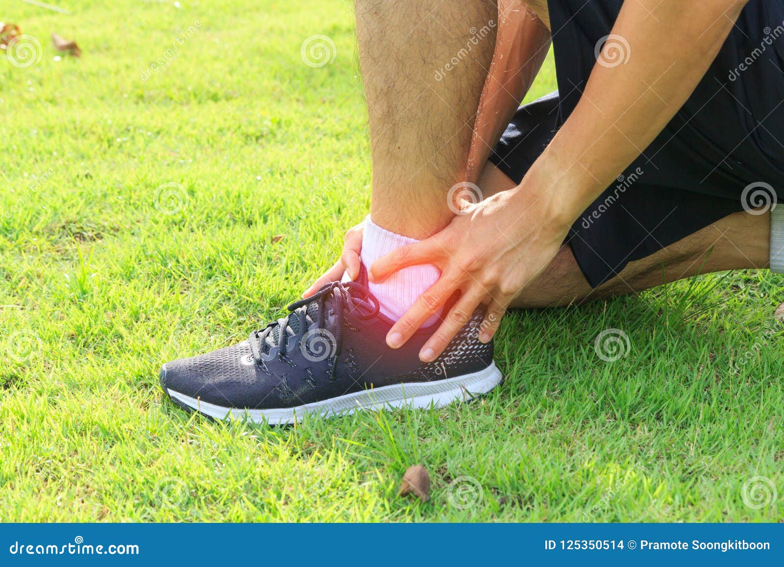 The Man Has Hurt at the Ankle Stock Photo - Image of shoes, injury ...