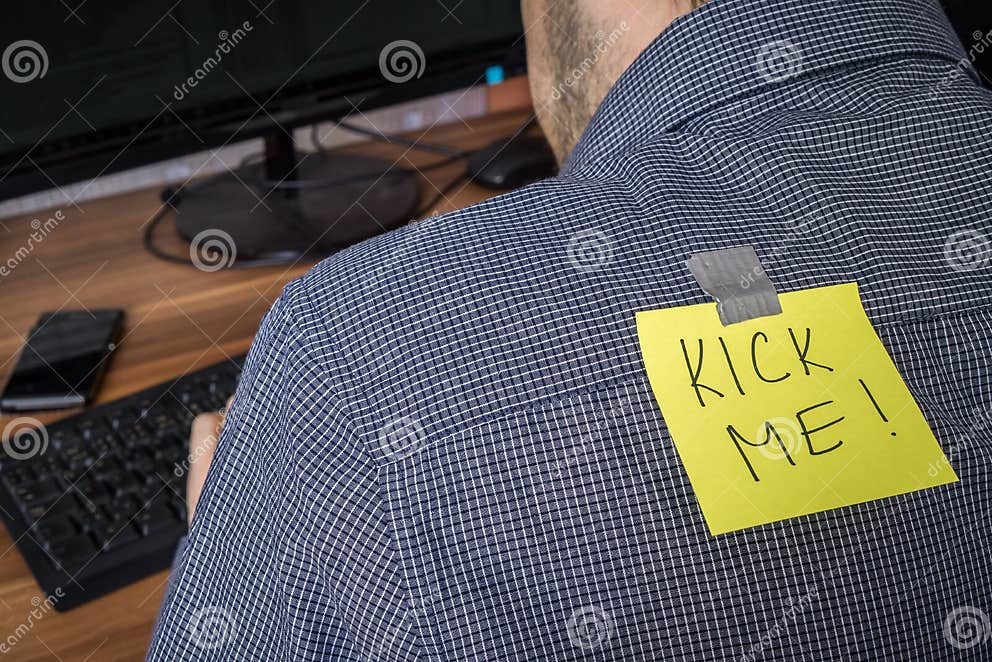Man Has Note with Kick Me Written on it. Joke on First April Stock ...