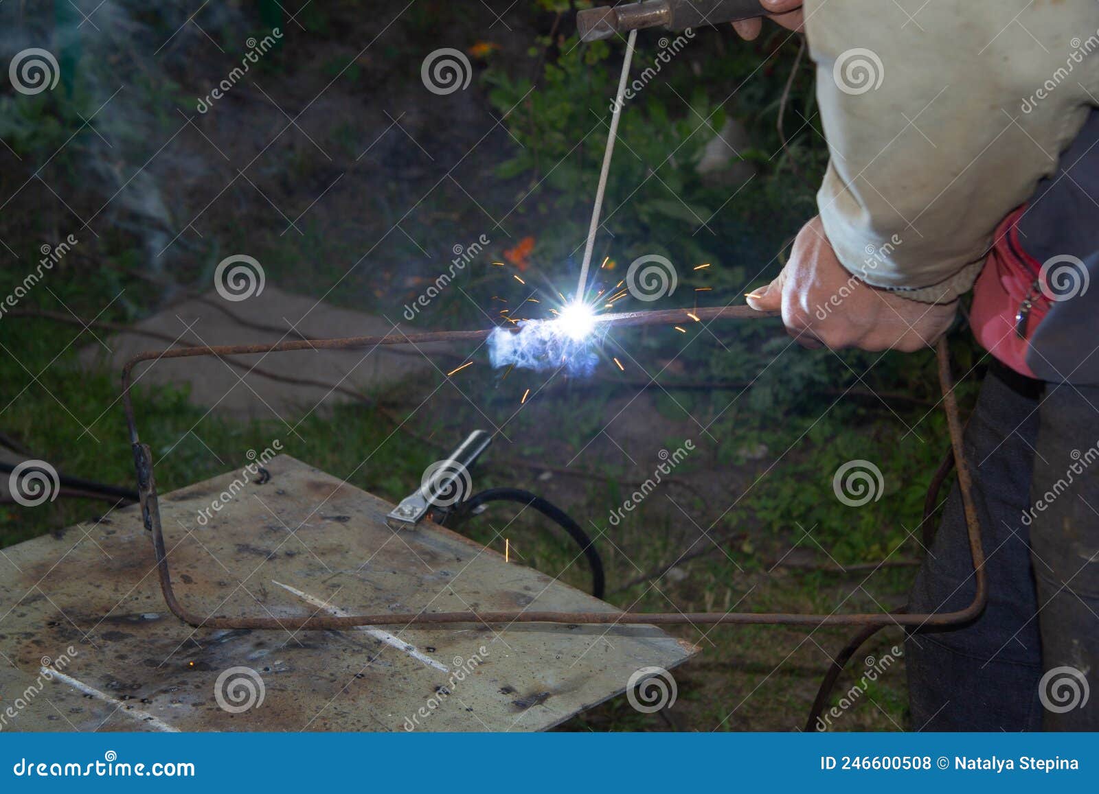 The Man Has Welding Equipment in His Hands. Welding of Iron ...