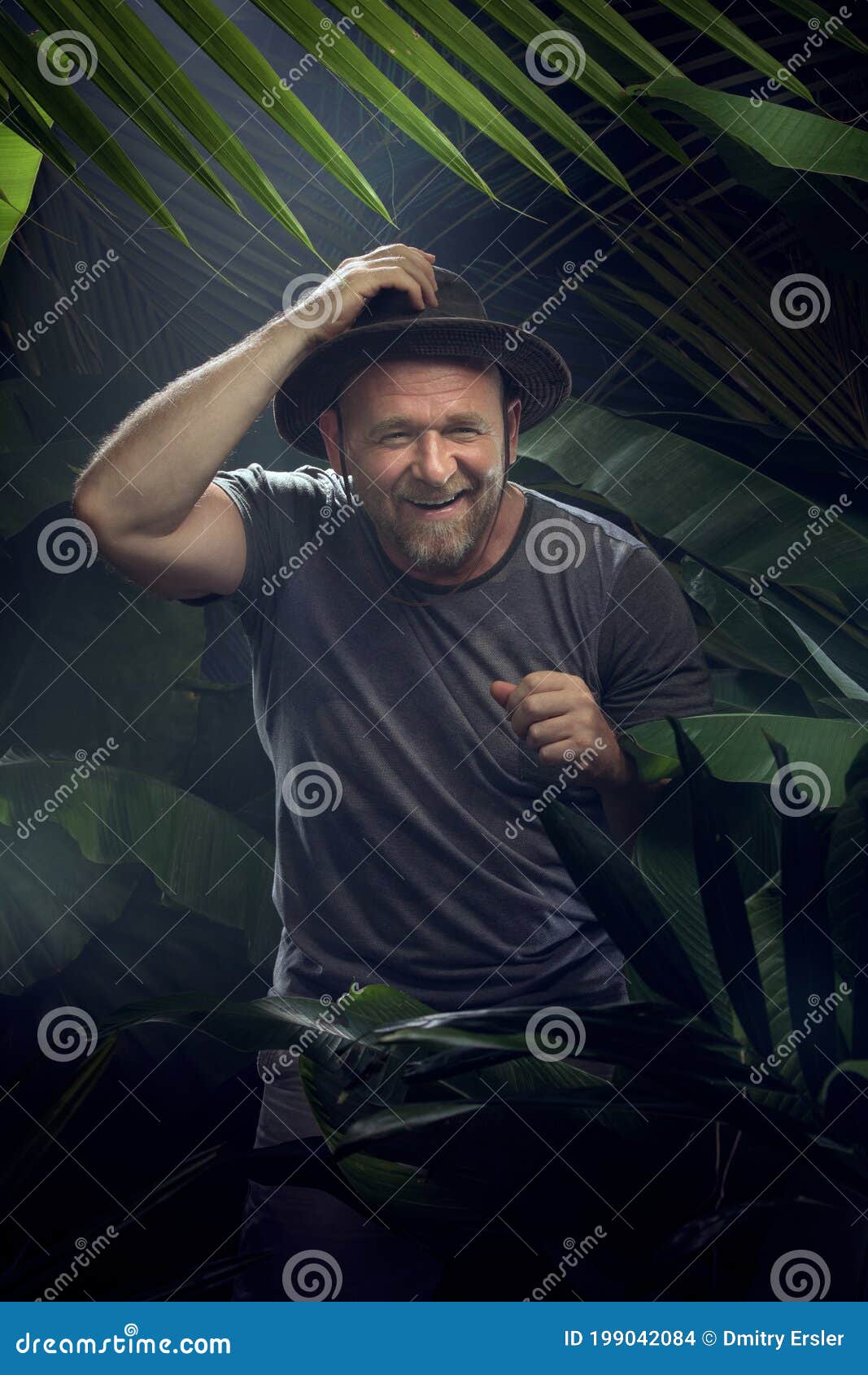 Man in Hat Exploring Jungle Environment Stock Photo - Image of ...