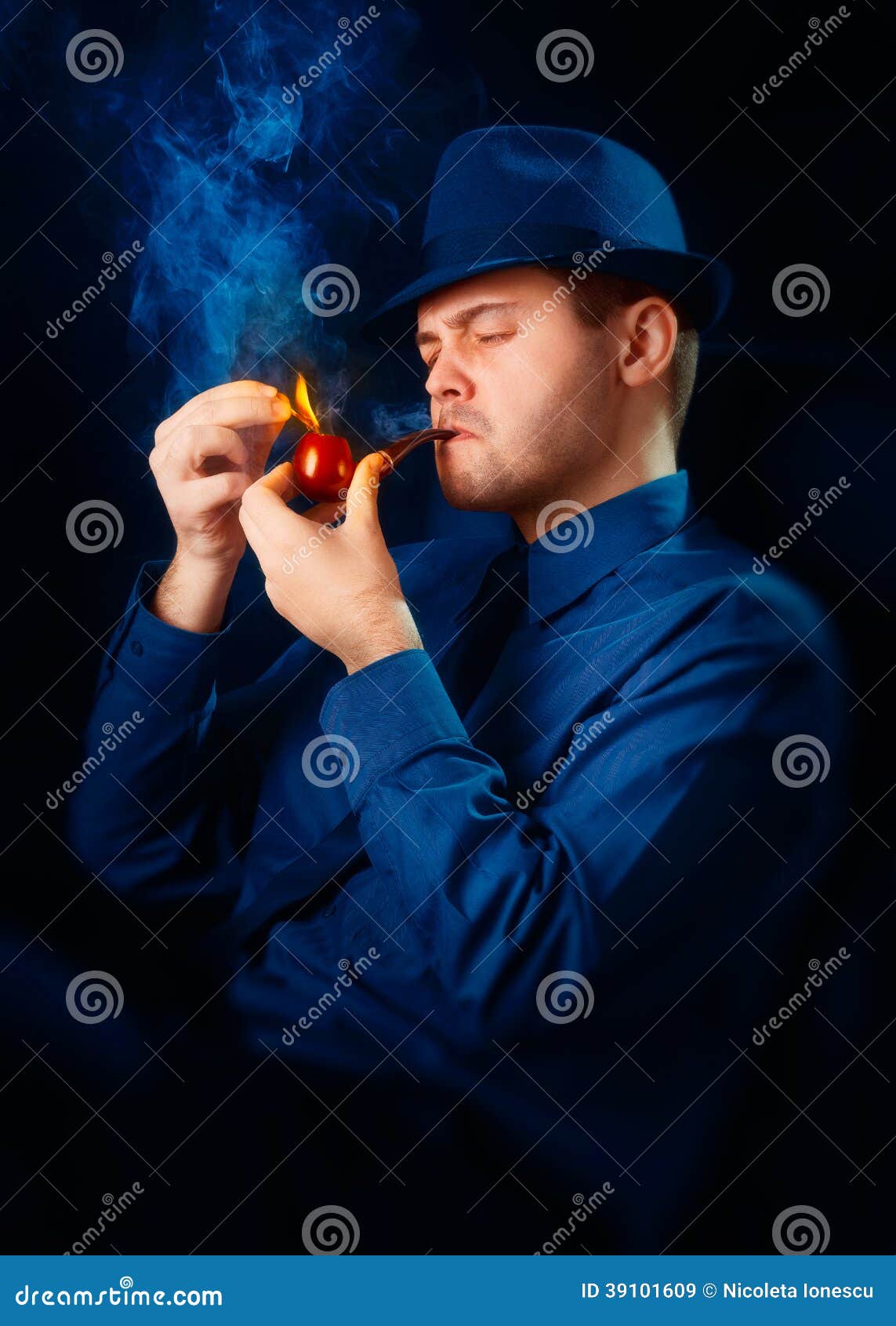 Man with Hat Lighting His Pipe with a Match Stock Image - Image of ...