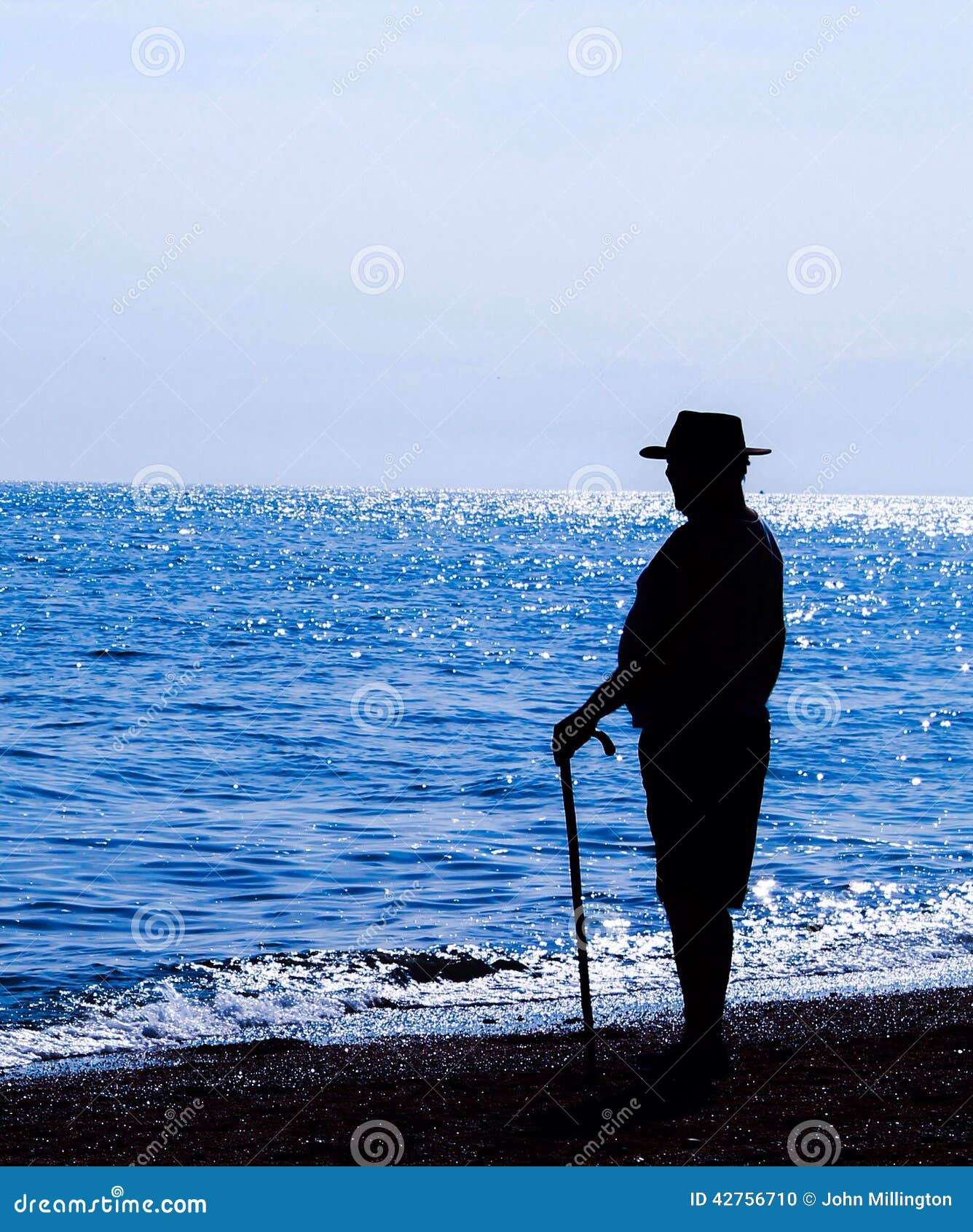 Man in a Hat Looking Out To Sea Stock Photo - Image of coastal, stick ...