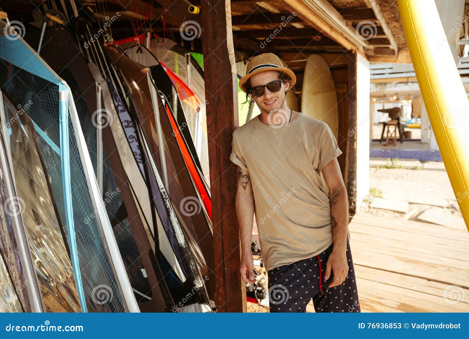 Man in Hat and Sunglasses Standing at the Surf Shack Stock Image ...