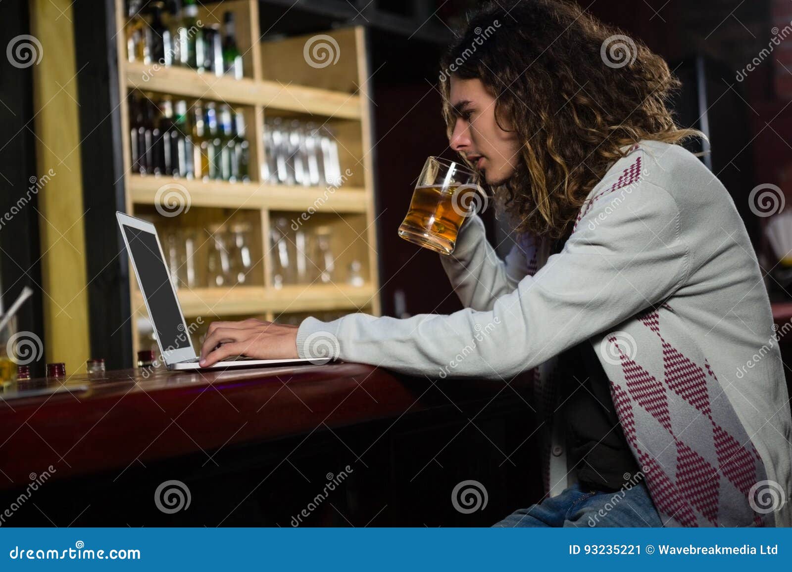 Man Having Beer while Using Laptop at Counter Stock Image - Image of ...