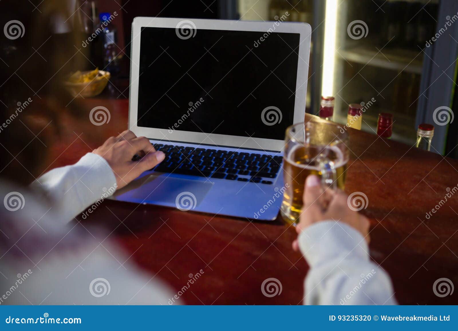 Man Having Beer while Using Laptop at Counter Stock Photo - Image of ...