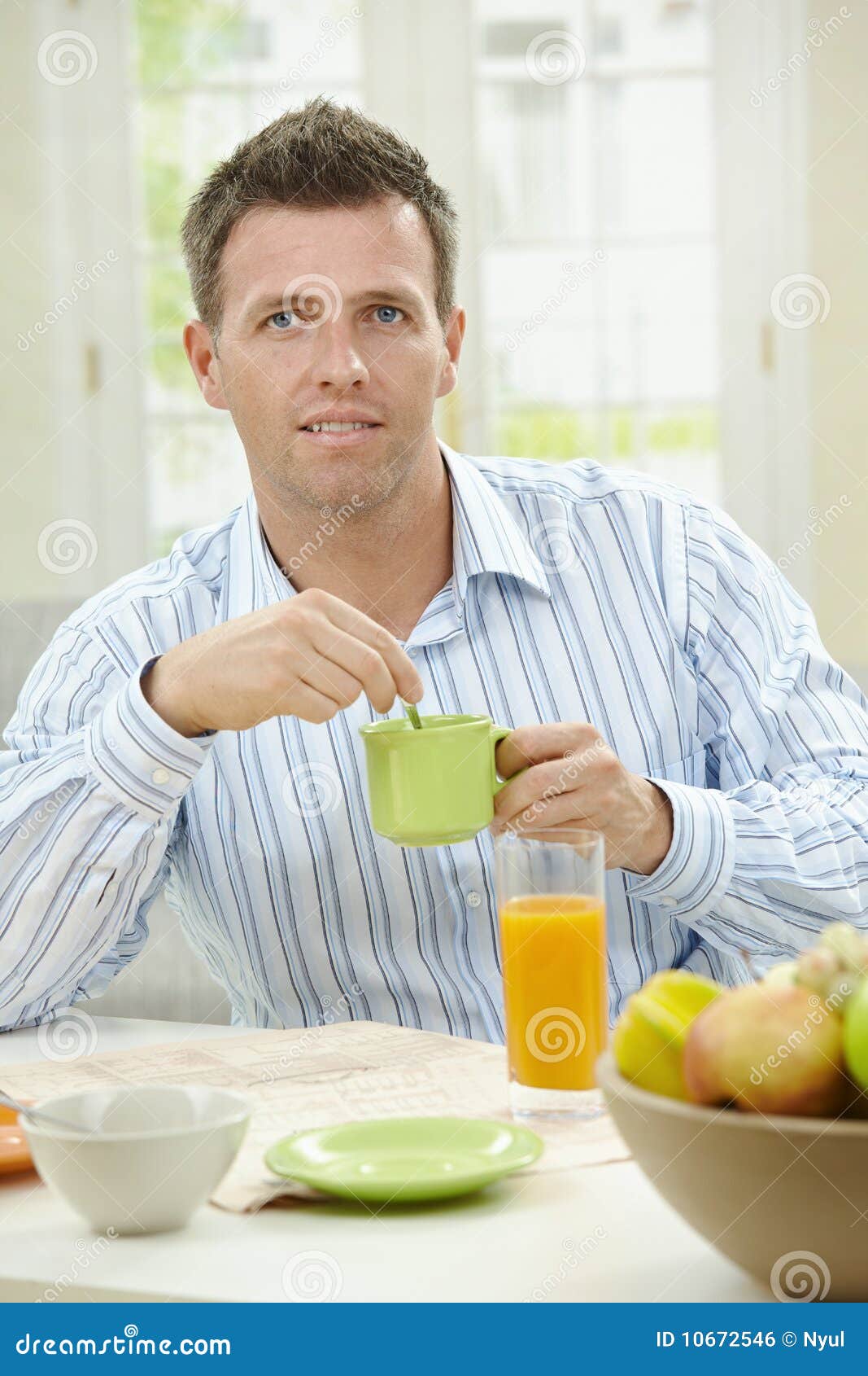 Man having breakfast stock photo. Image of furniture - 10672546