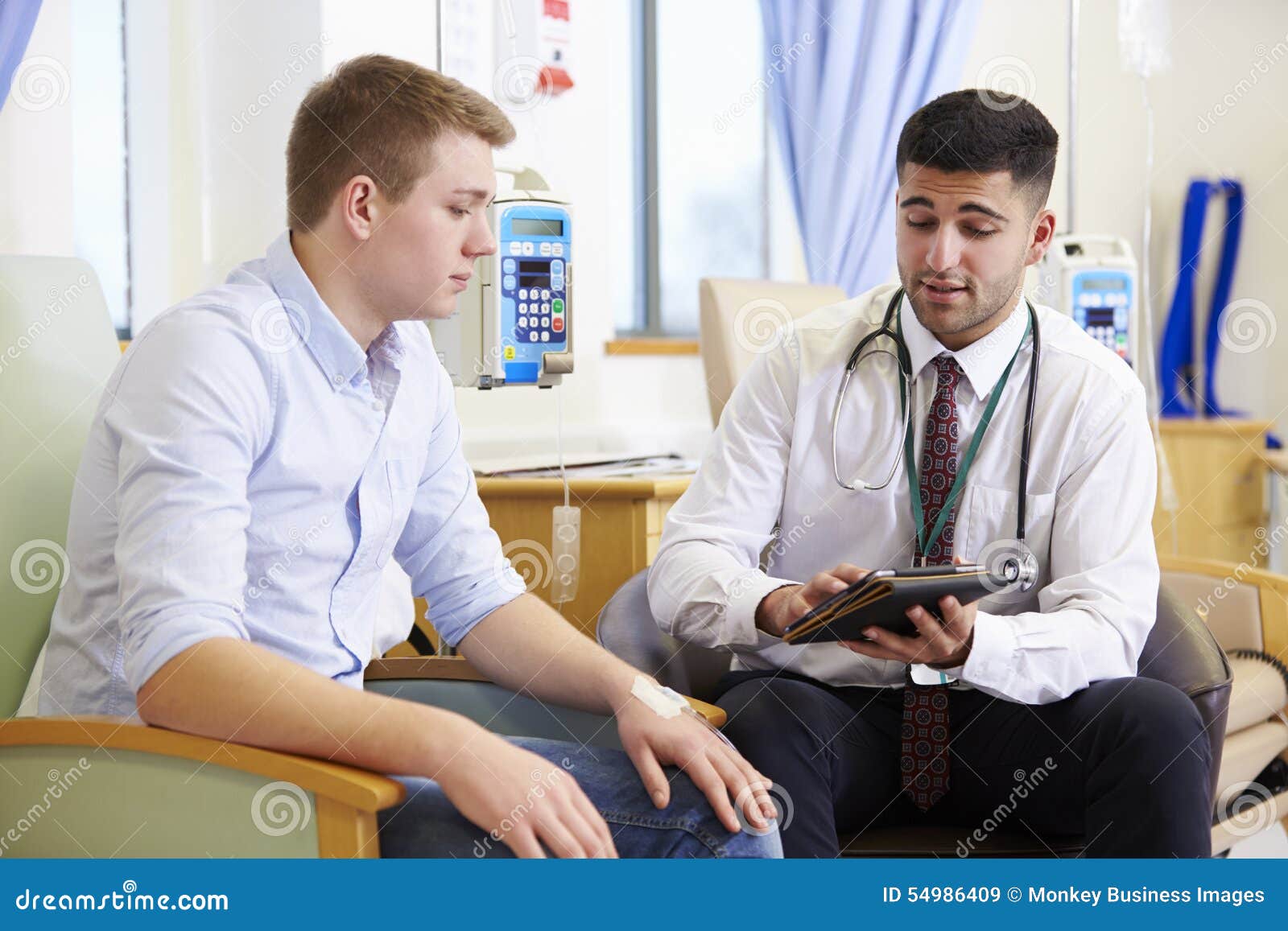 Man Having Chemotherapy with Doctor Using Digital Tablet Stock Image ...