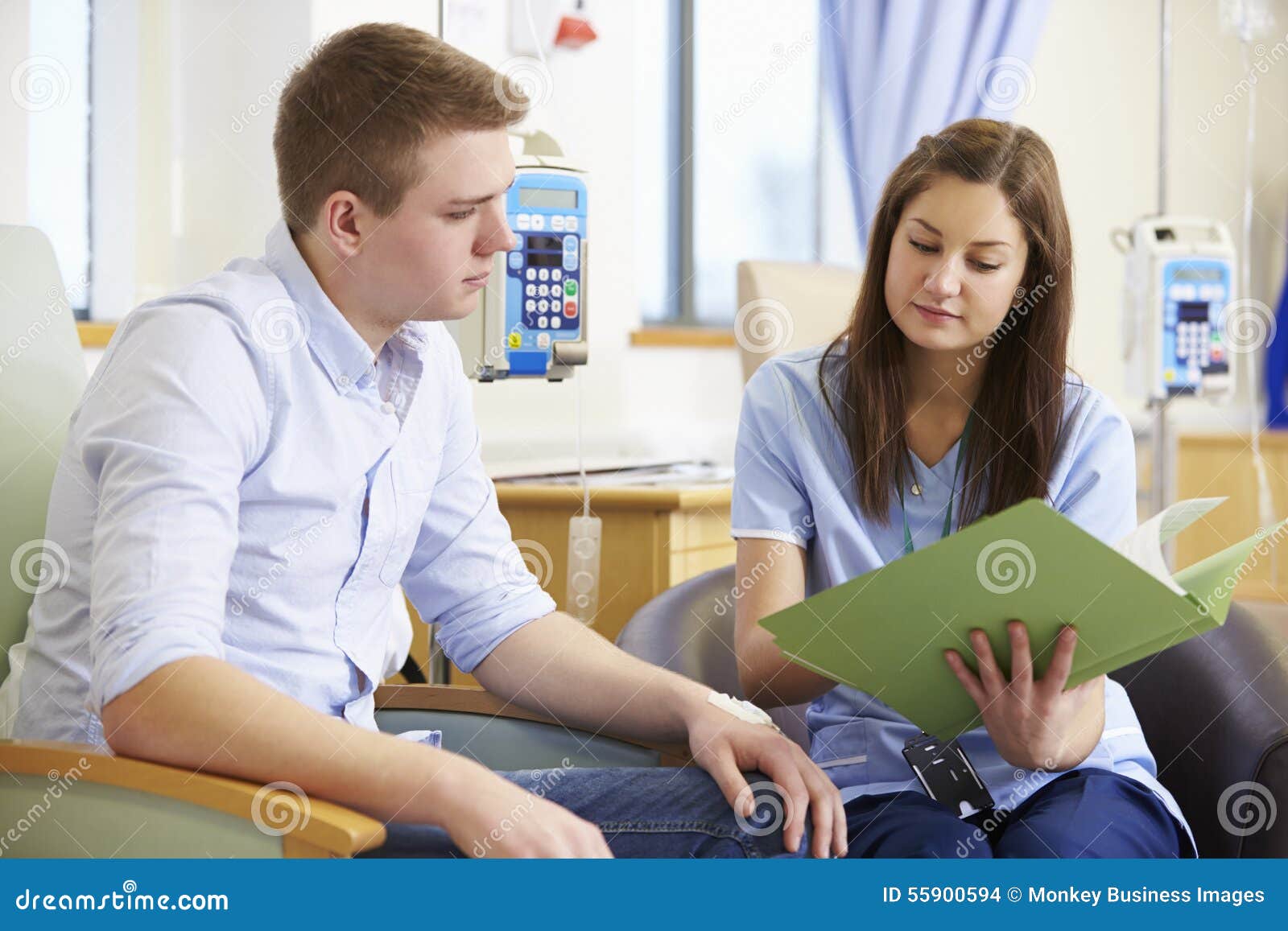 Man Having Chemotherapy Looking at Test Results with Nurse Stock Photo ...