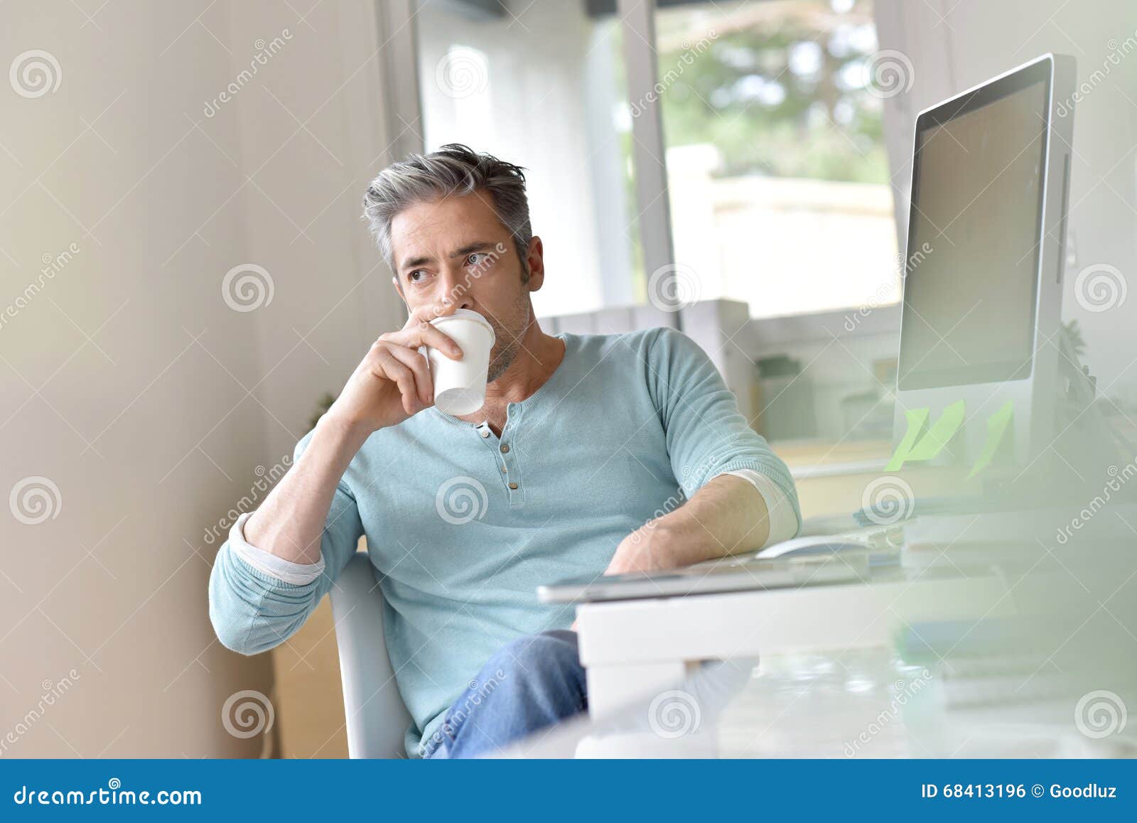 Man having coffee at work stock photo. Image of people - 68413196