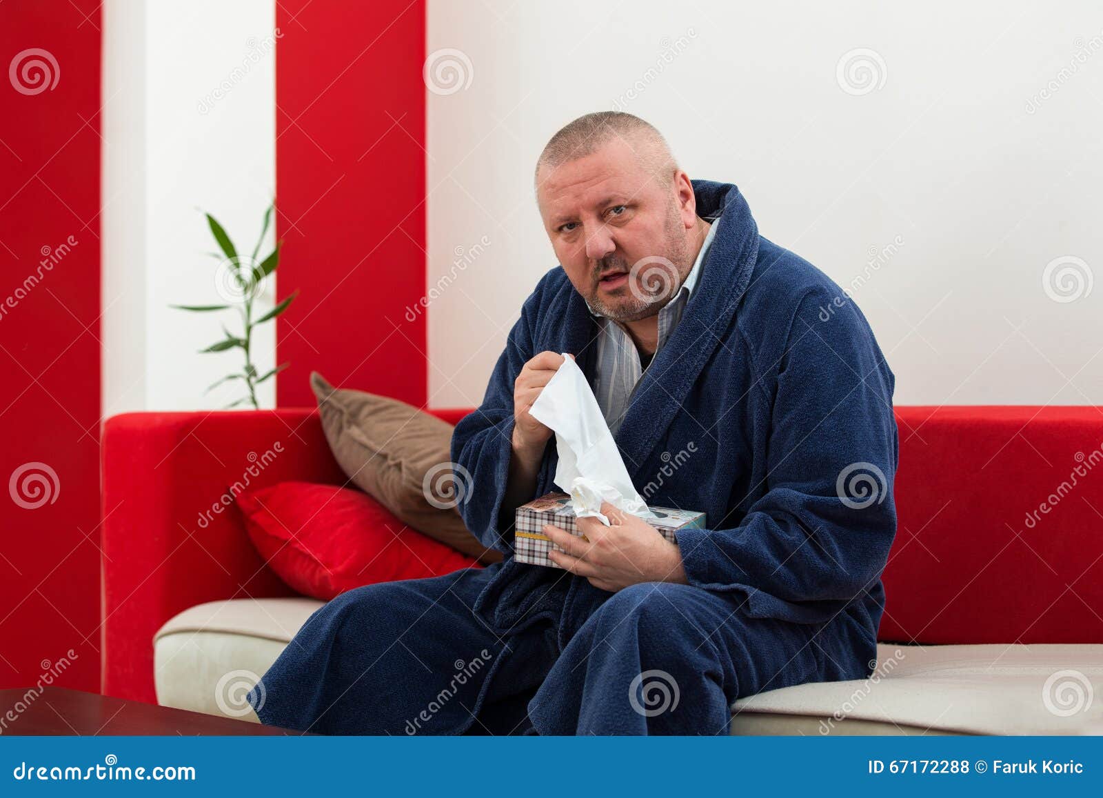 Man Having a Cold Holding Tissue with Box Full of Tissues Stock Photo ...