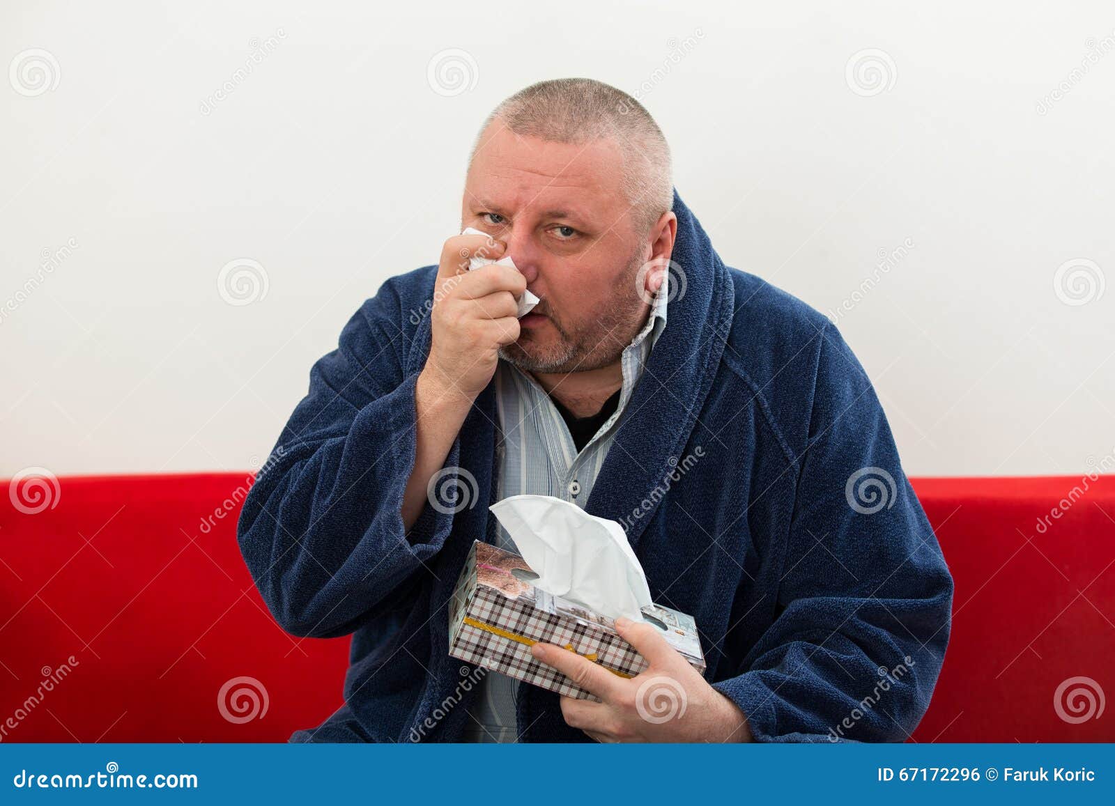 Man Having a Cold Holding Tissue with Box Full of Tissues Stock Photo ...