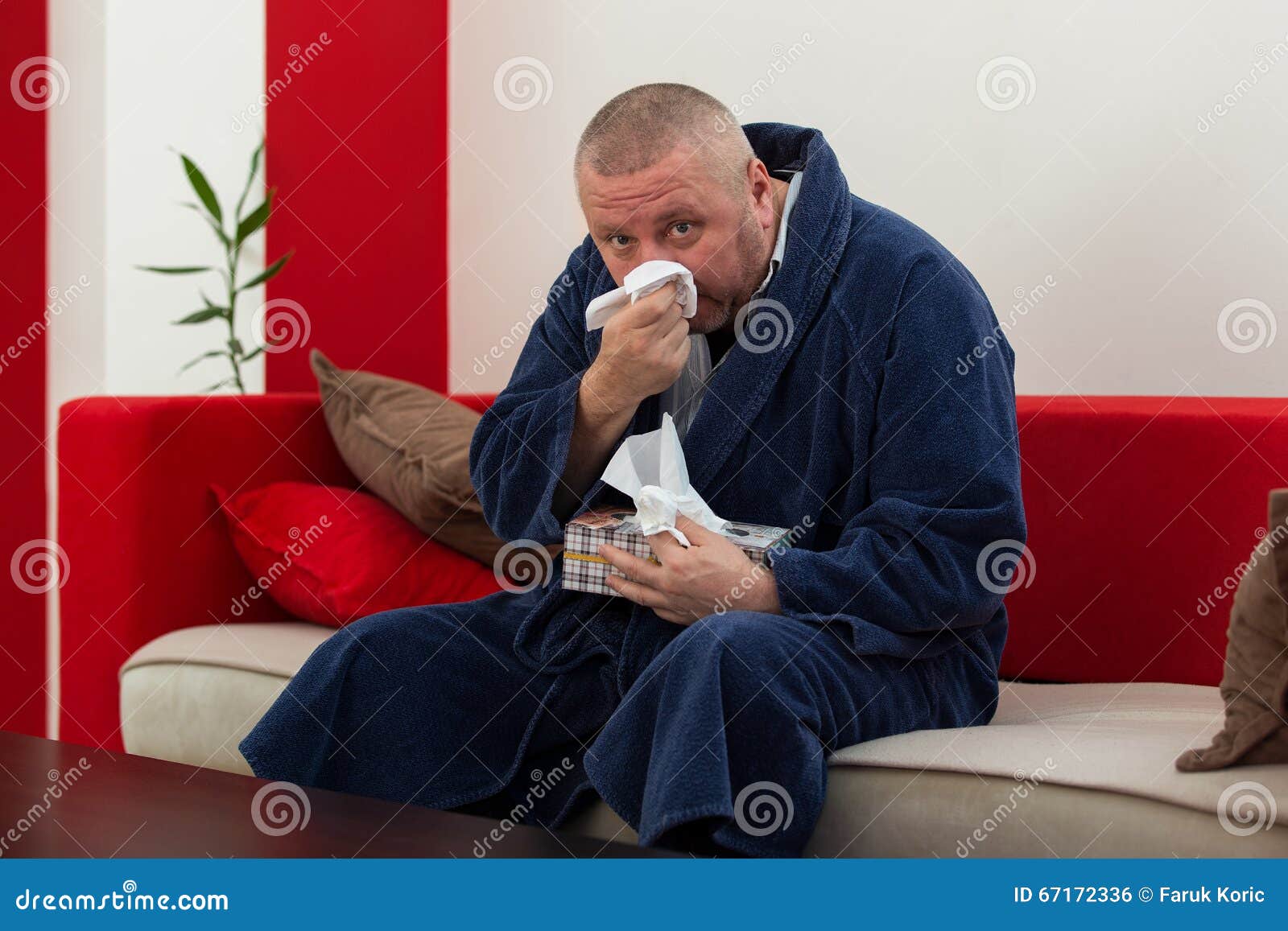 Man Having a Cold Holding Tissue with Box Full of Tissues Stock Photo ...