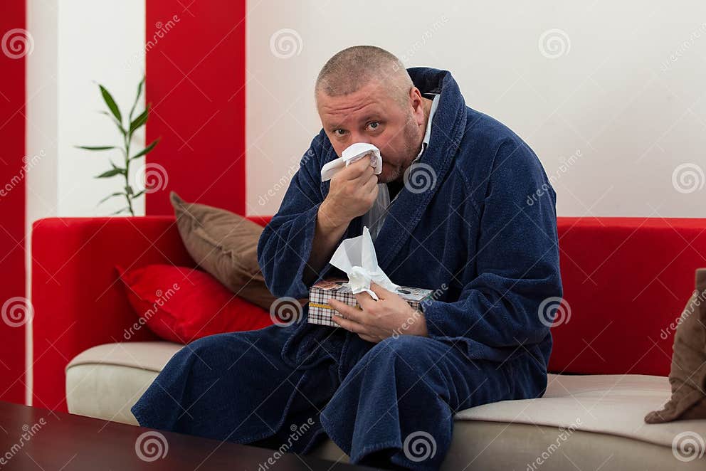 Man Having a Cold Holding Tissue with Box Full of Tissues Stock Photo ...