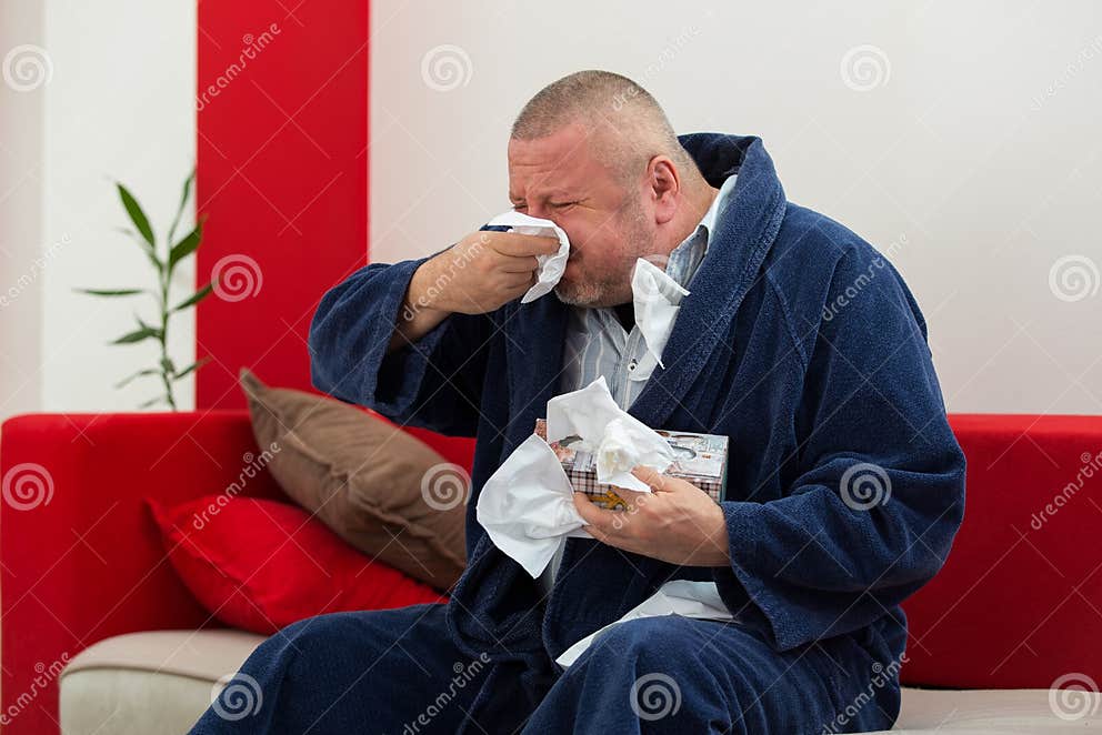 Man Having a Cold Holding Tissue with Box Full of Tissues Stock Photo ...