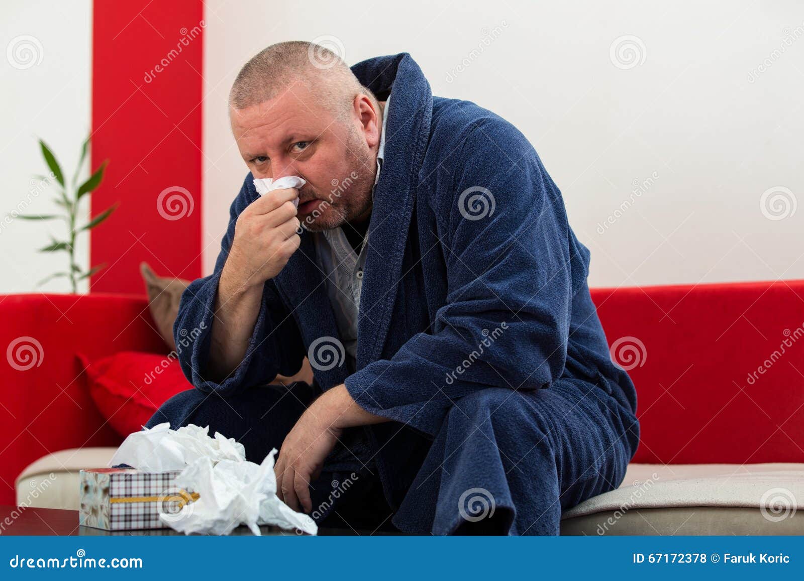 Man Having a Cold Holding Tissue with Box Full of Tissues Stock Photo ...