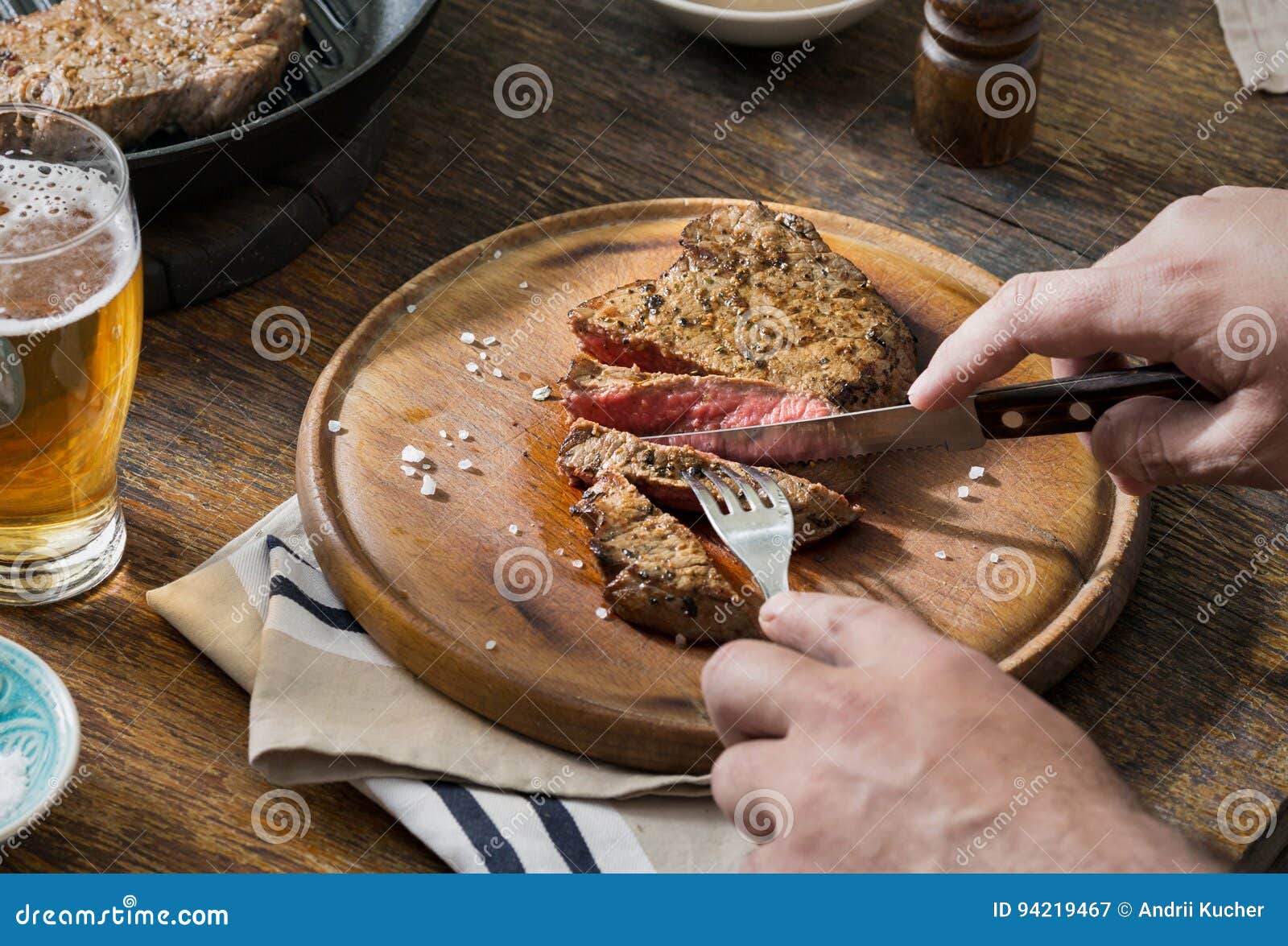 Man is Having Dinner Steak on a Rustic Wooden Table Stock Image - Image ...