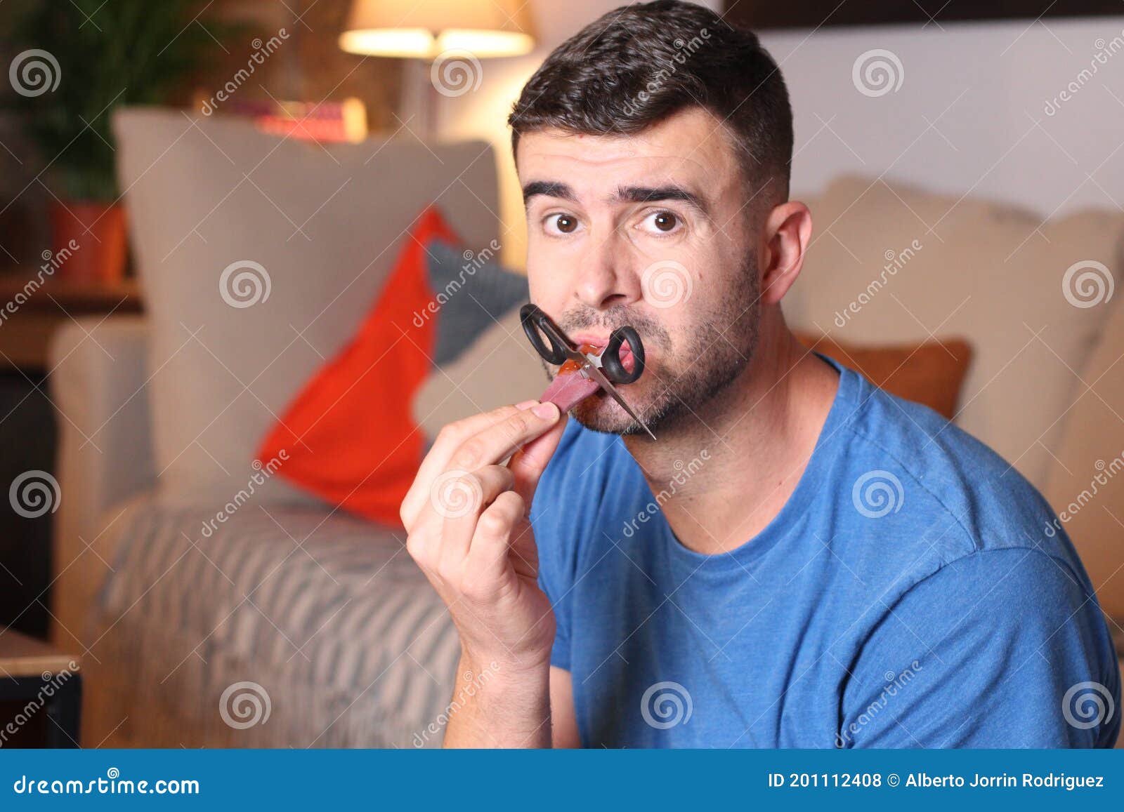 Man Having Domestic Accident with Pair of Scissors Stock Photo - Image ...