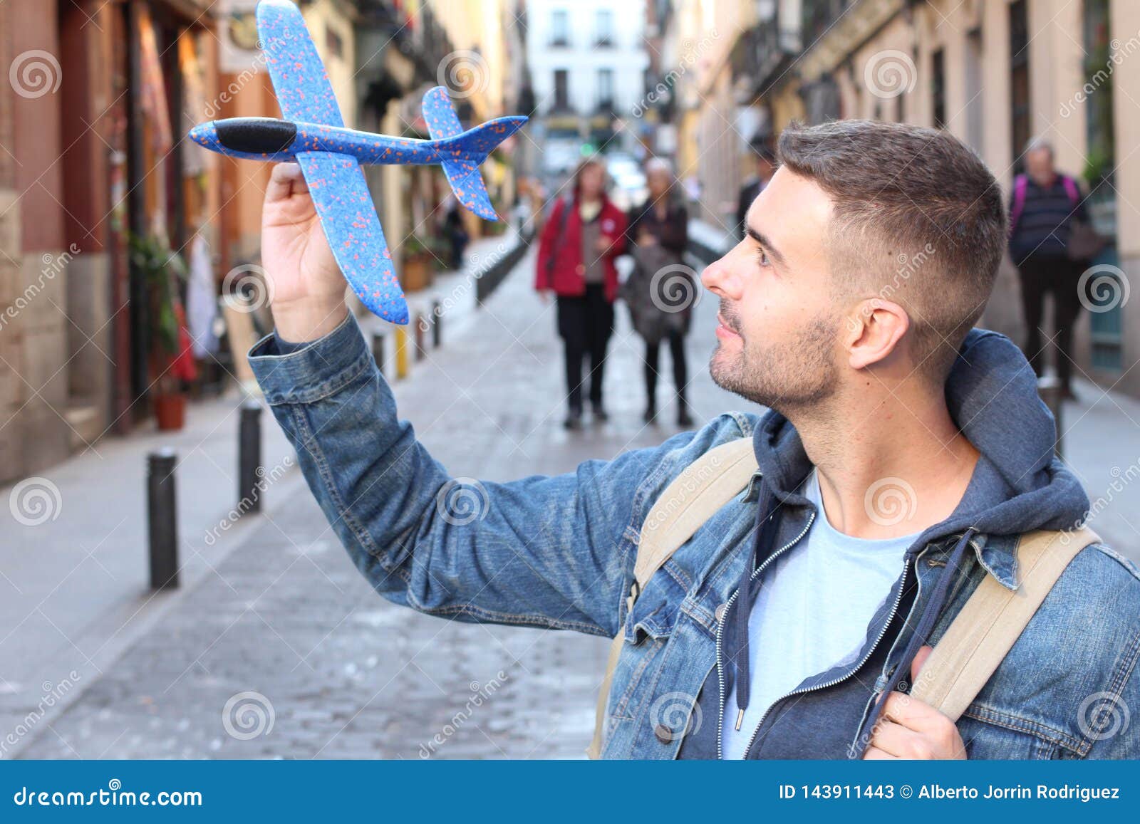Man having fun with a toy stock image. Image of confident - 143911443