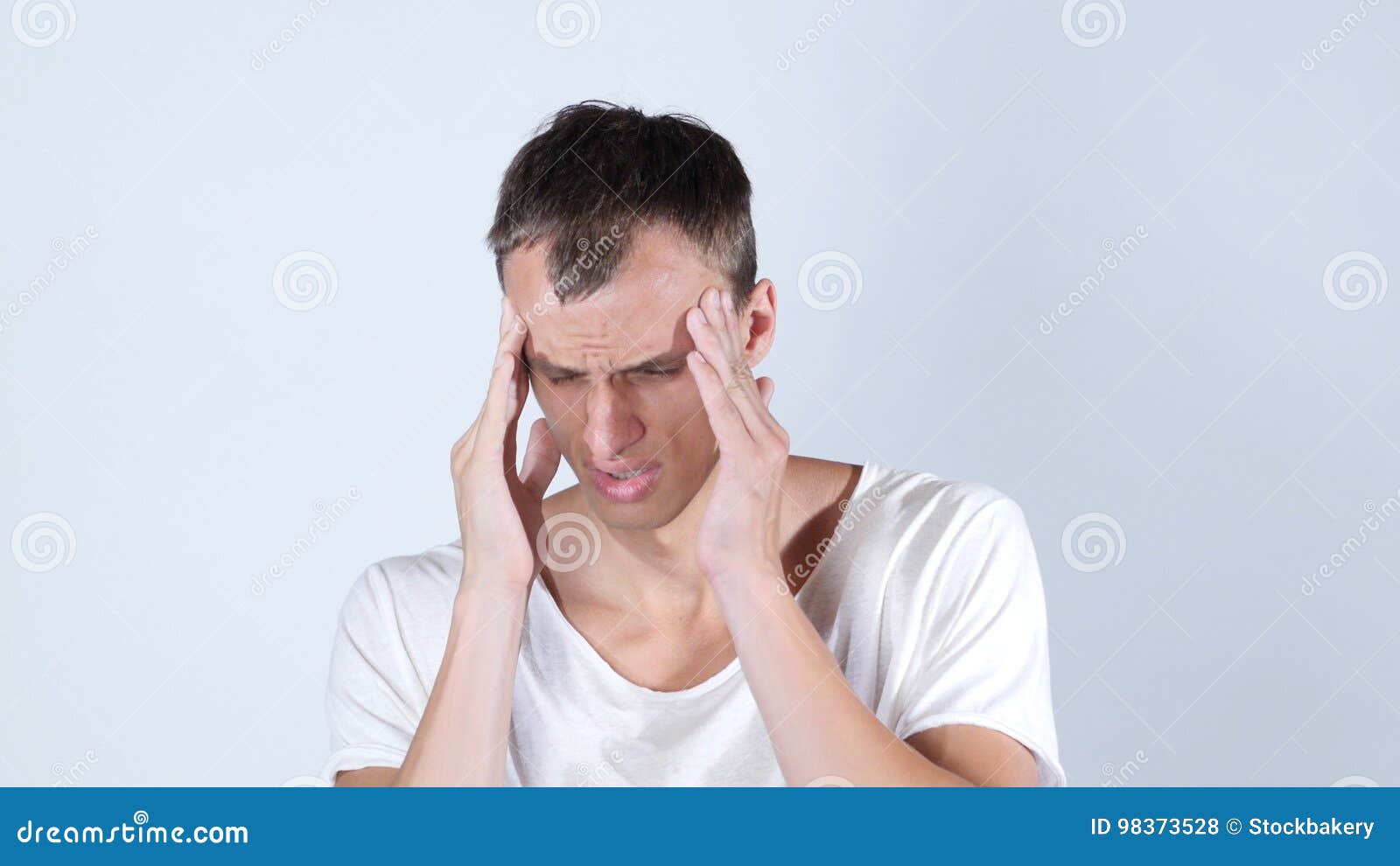 Man having a headache stock photo. Image of sofa, people - 98373528