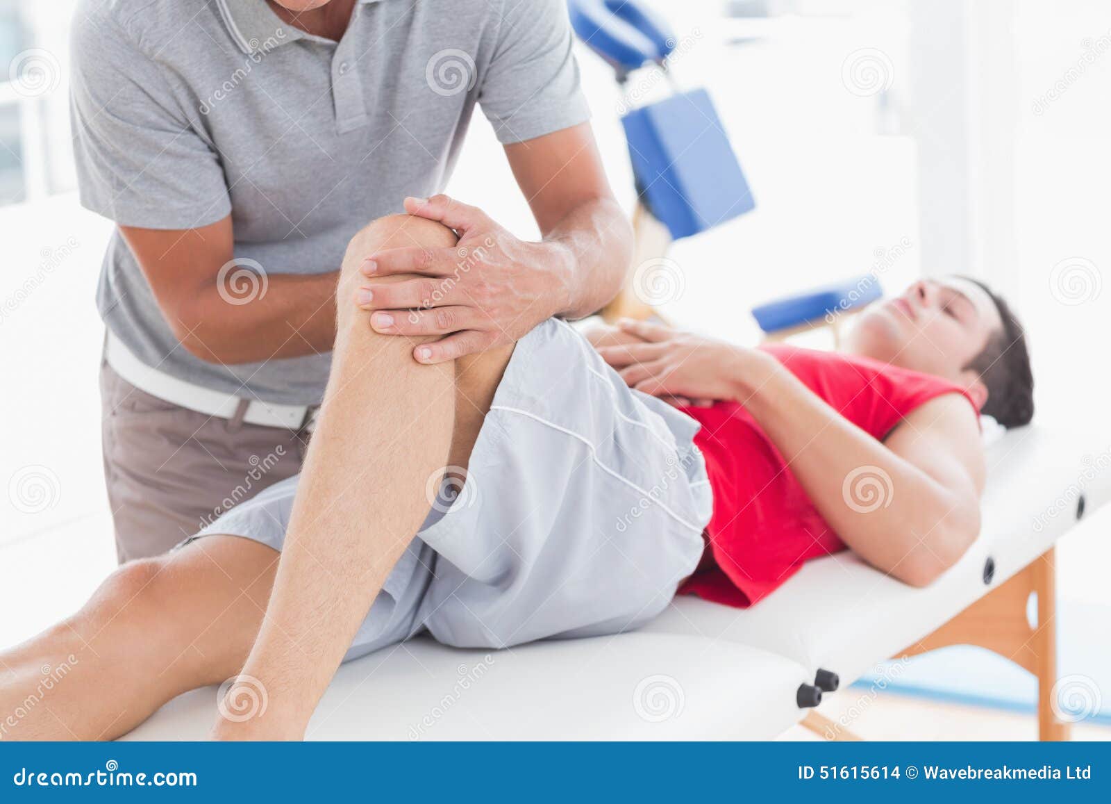 Man having knee massage stock photo. Image of lying, knee - 51615614