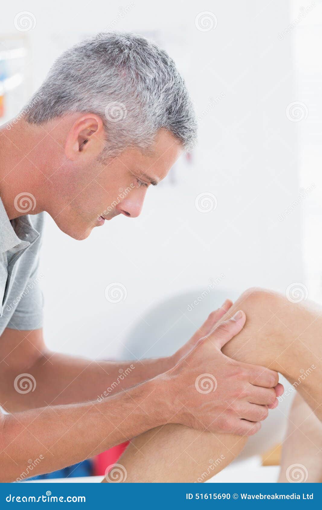 Man having knee massage stock photo. Image of health - 51615690