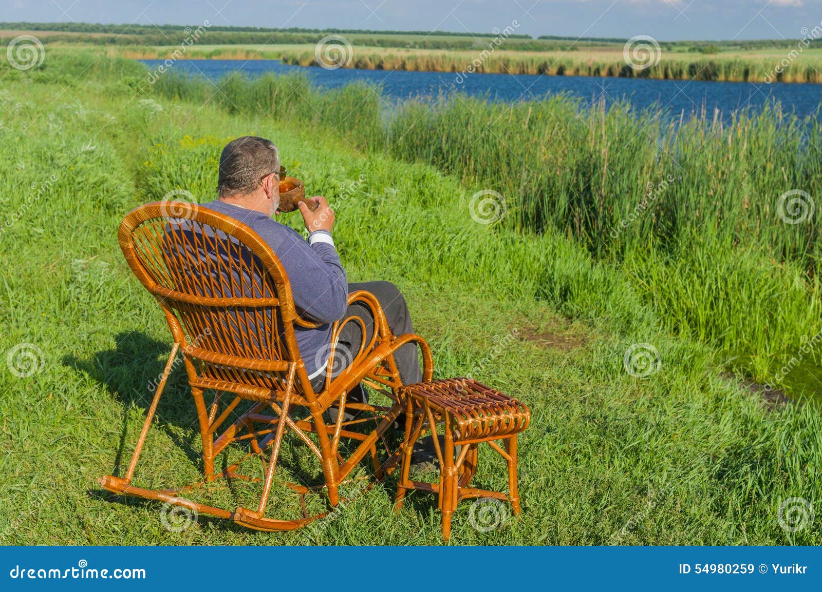 Man Having Rest on a Riverside Stock Image - Image of stool, green ...