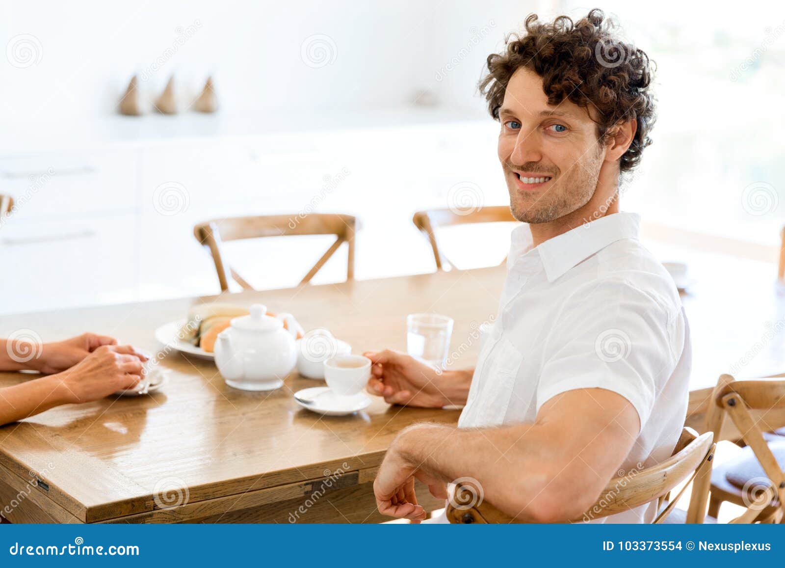 Man having tea at home stock photo. Image of indoors - 103373554